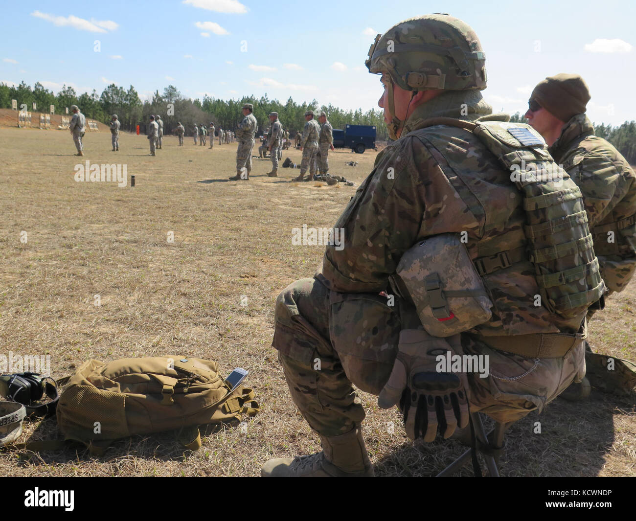 U.S. Soldiers in the South Carolina Army National Guard observe an M9 ...