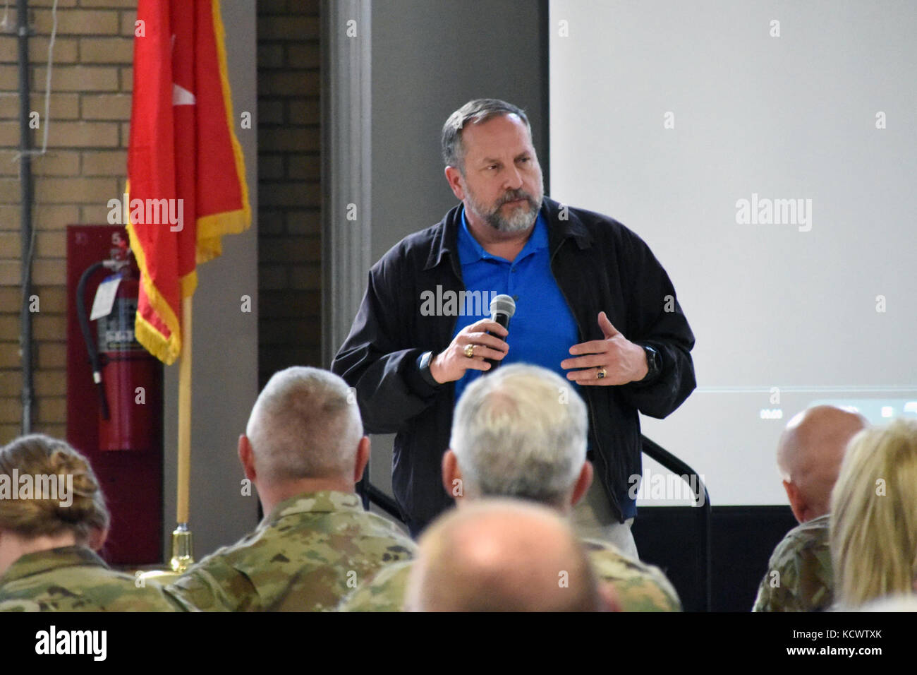 Mr. Kenneth Braddock, state operations chief of staff, speaks to the ...