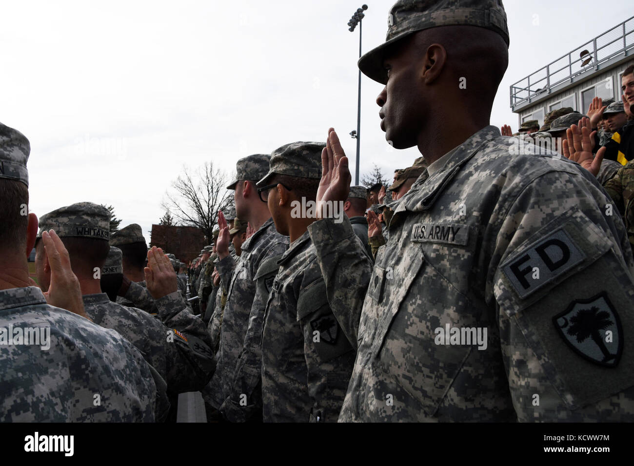 Soldiers with the South Carolina National Guard raised their right ...