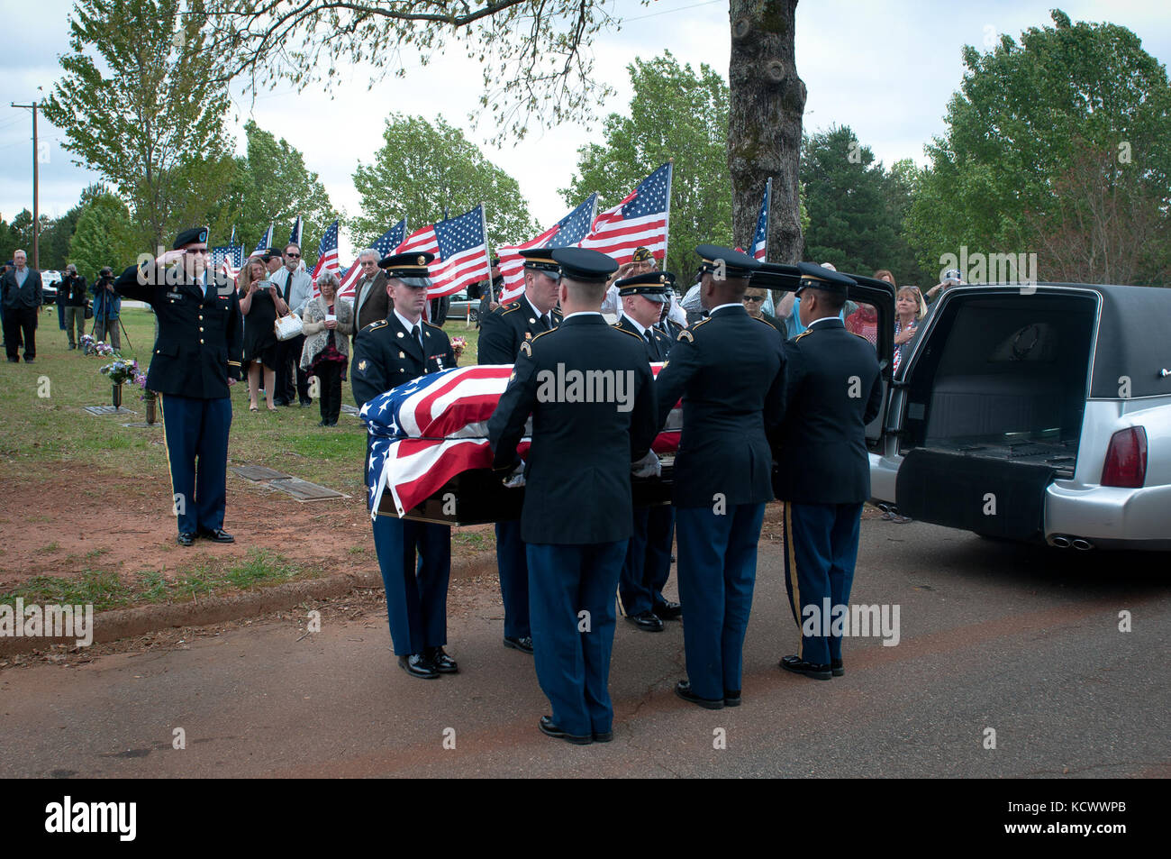 Survivors attend a funeral service held in honor of former U.S. Army ...