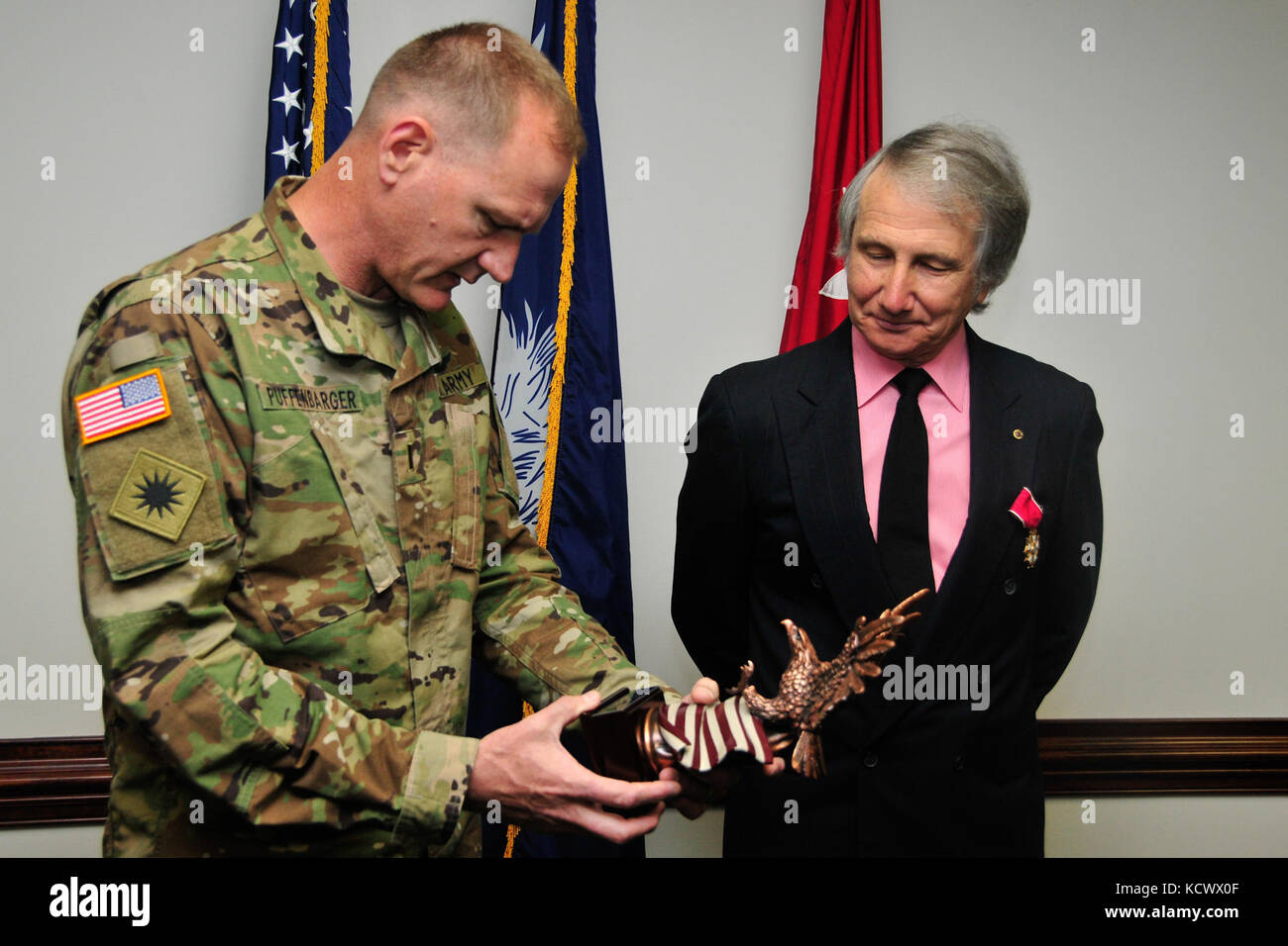 U.S. Army Chief Warrant Officer 5 Kent Puffenbarger presents Chief ...