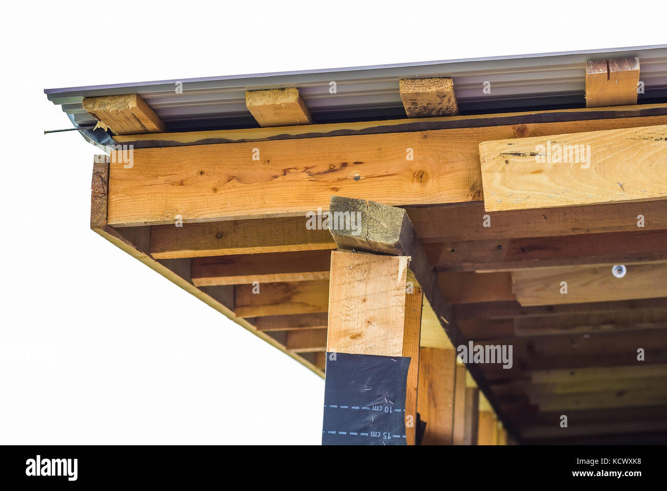 Detail of roofing construction on a new house. Wooden boards frame ...