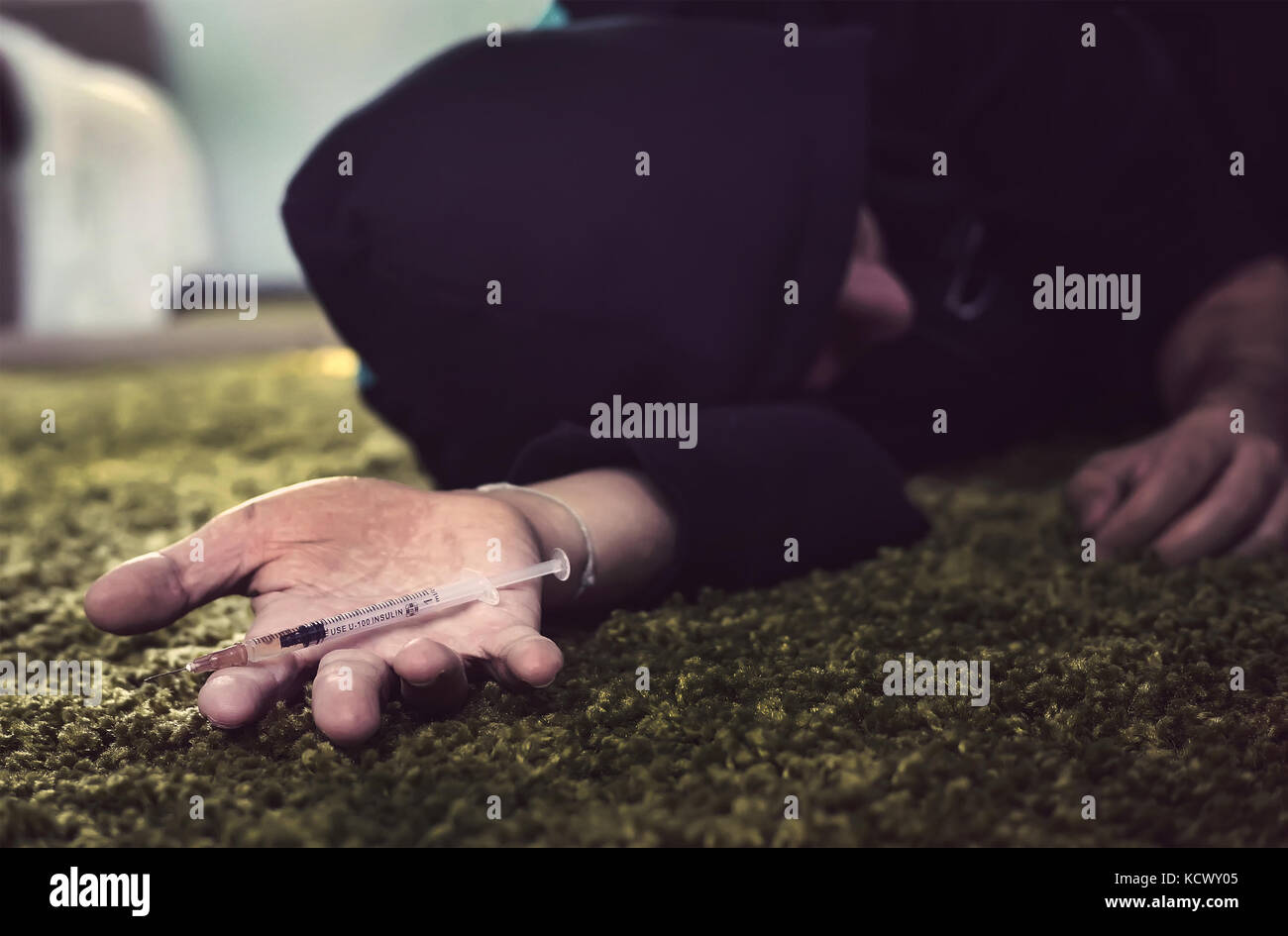 Close-up on the floor of the syringe with the drug. In the background ...