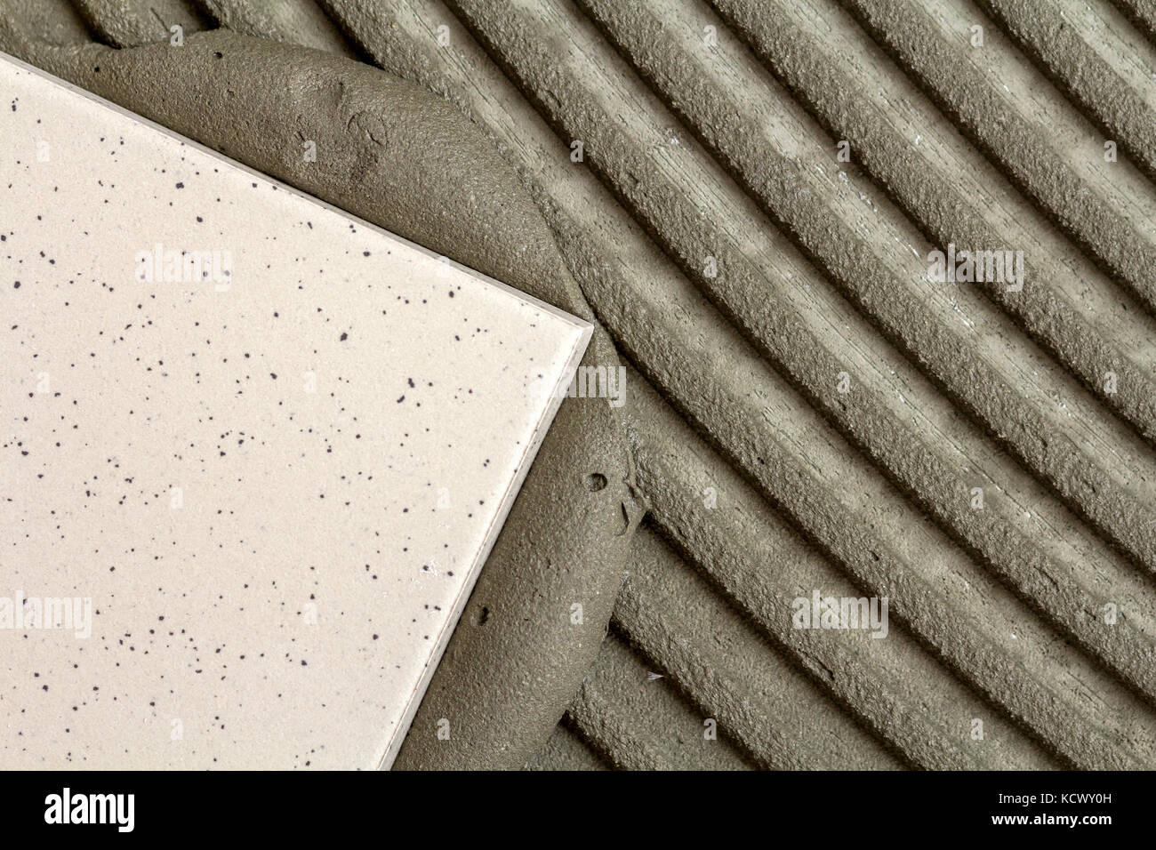 Close-up detail of floor tiles installation. Home improvement ...