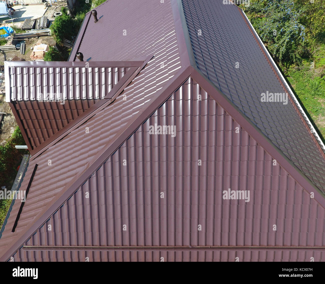 The roof of corrugated sheet. Roofing of metal profile wavy shape. A ...