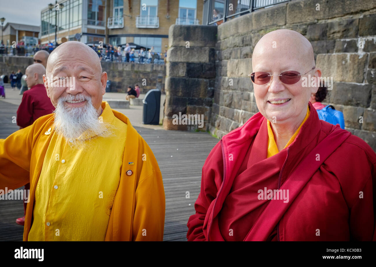 Monks walking in Cardiff Bay, Wales Stock Photo - Alamy