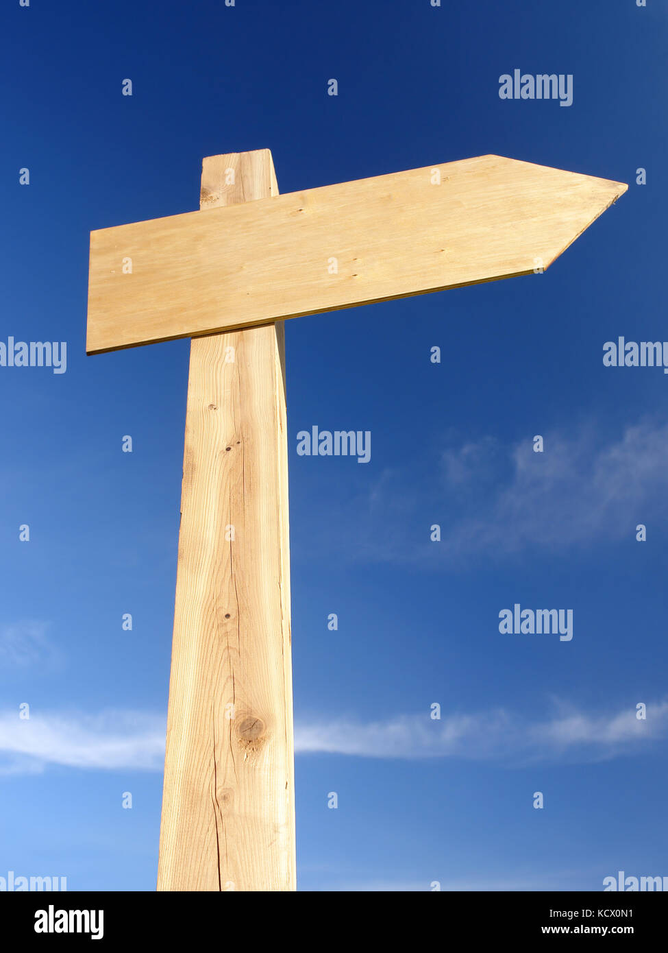 Blank wooden signpost over blue sky Stock Photo - Alamy
