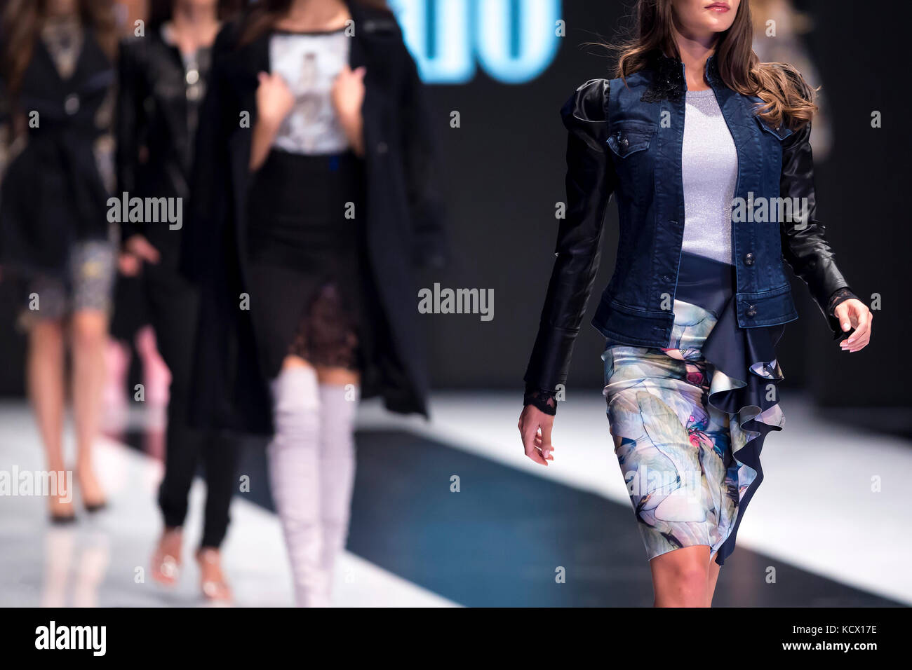 Female models walk the runway in different dresses during a Fashion ...