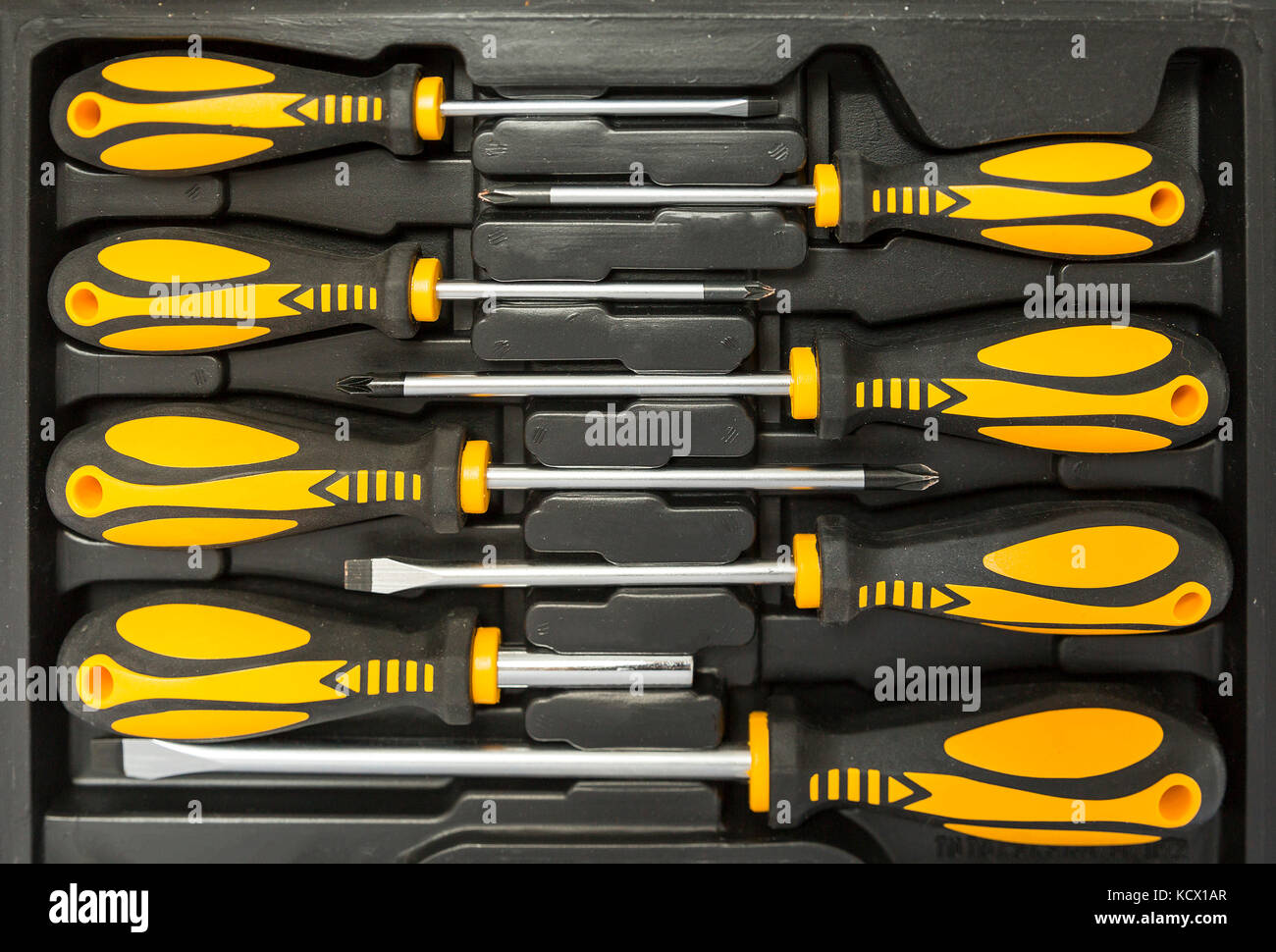 Set of screwdrivers in a box with rubber black and yellow handles Stock ...