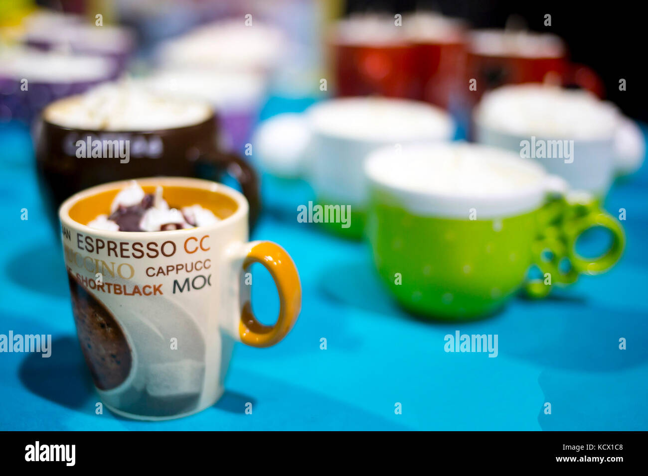 Cups of coffee with cream on top. Espresso latte with cinnamon and ...