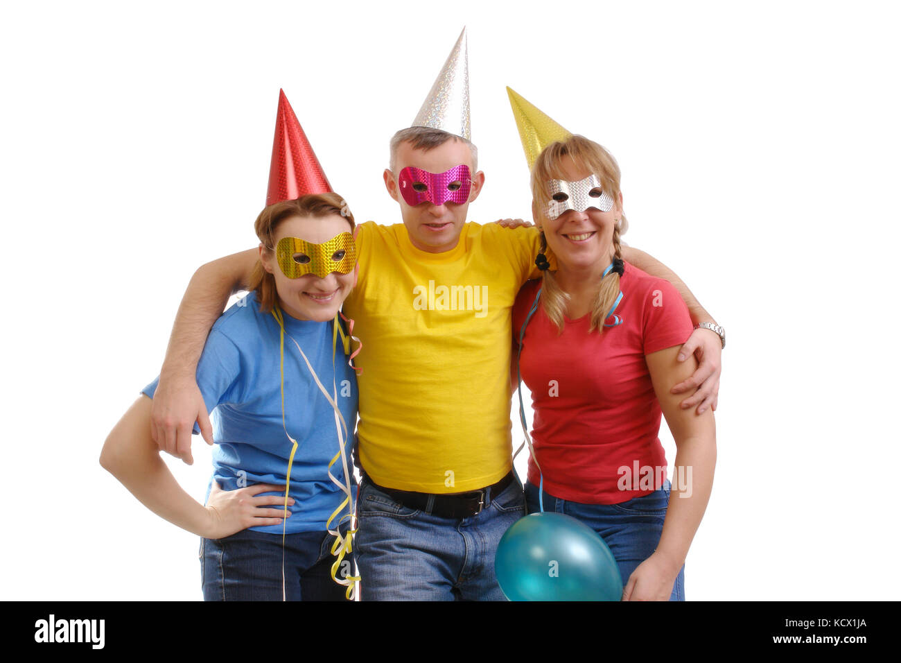 Group of friends wearing party masks and hats posing over white Stock ...