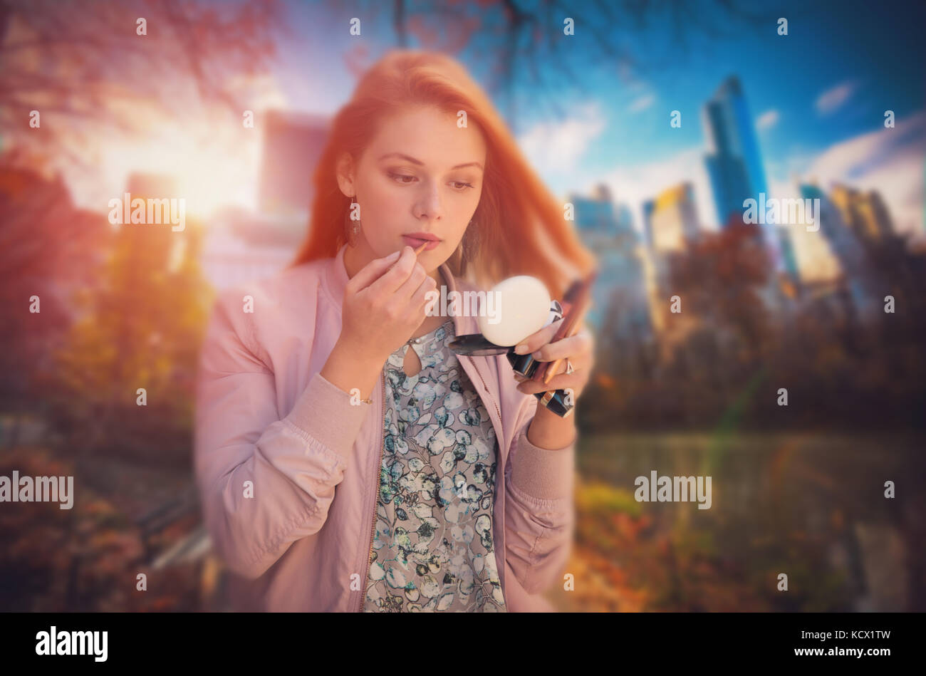girl doing makeup on the street. in the central park in Manhattan New ...