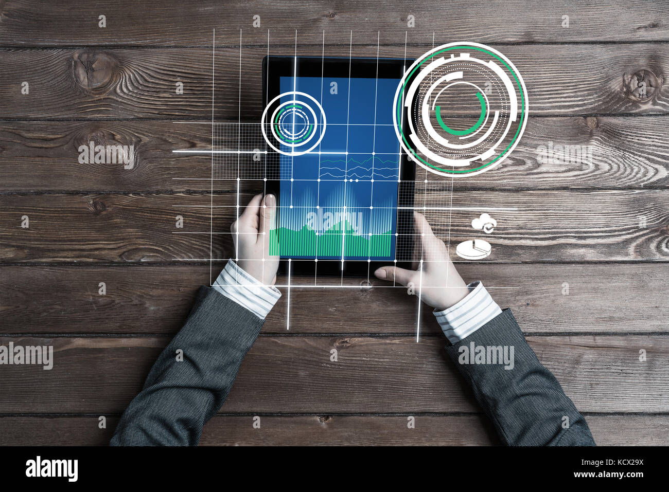 Business workplace with tablet device and media graphs and diagrams ...
