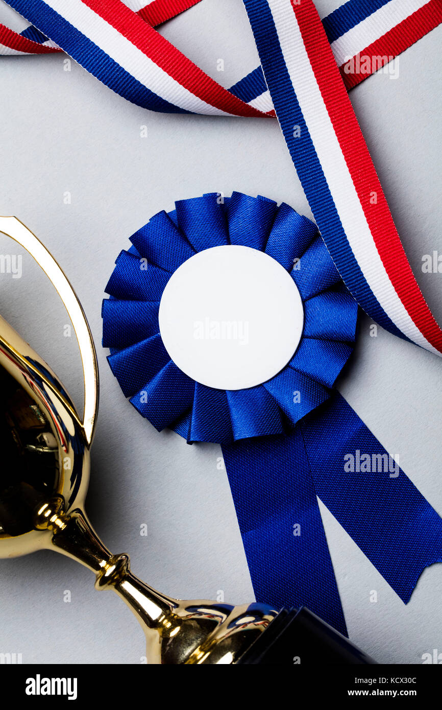 First place trophy and award rosette. Success achievement concept Stock ...