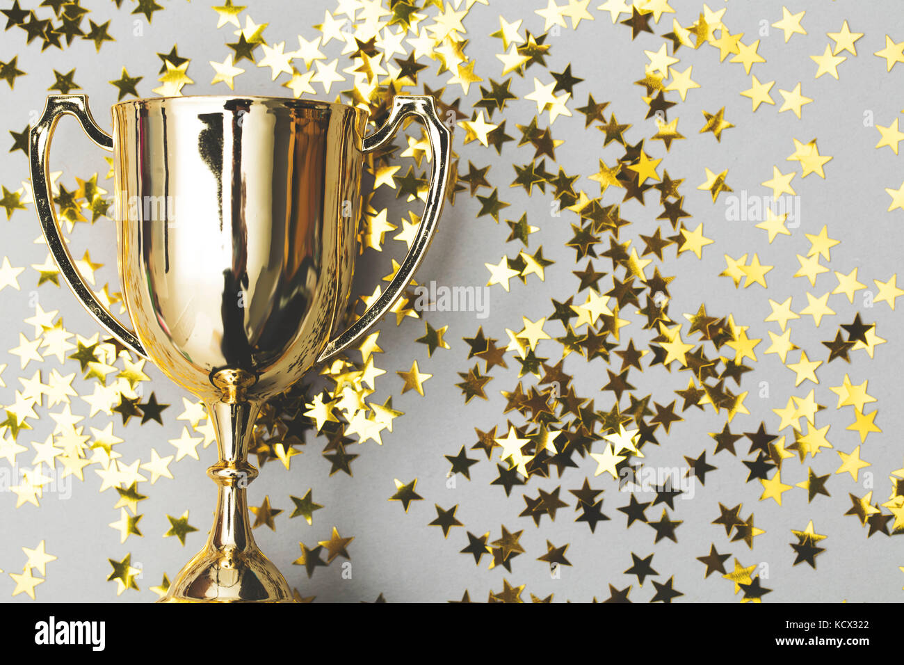 Gold winners trophy with golden shiny stars Stock Photo - Alamy