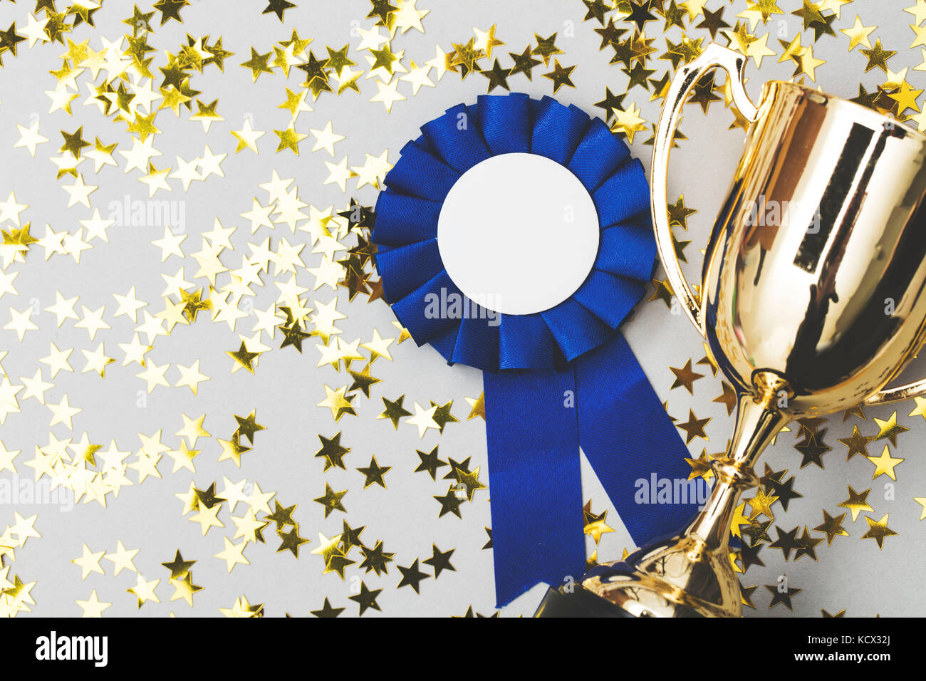 Winners background with trophy and rosette Stock Photo - Alamy