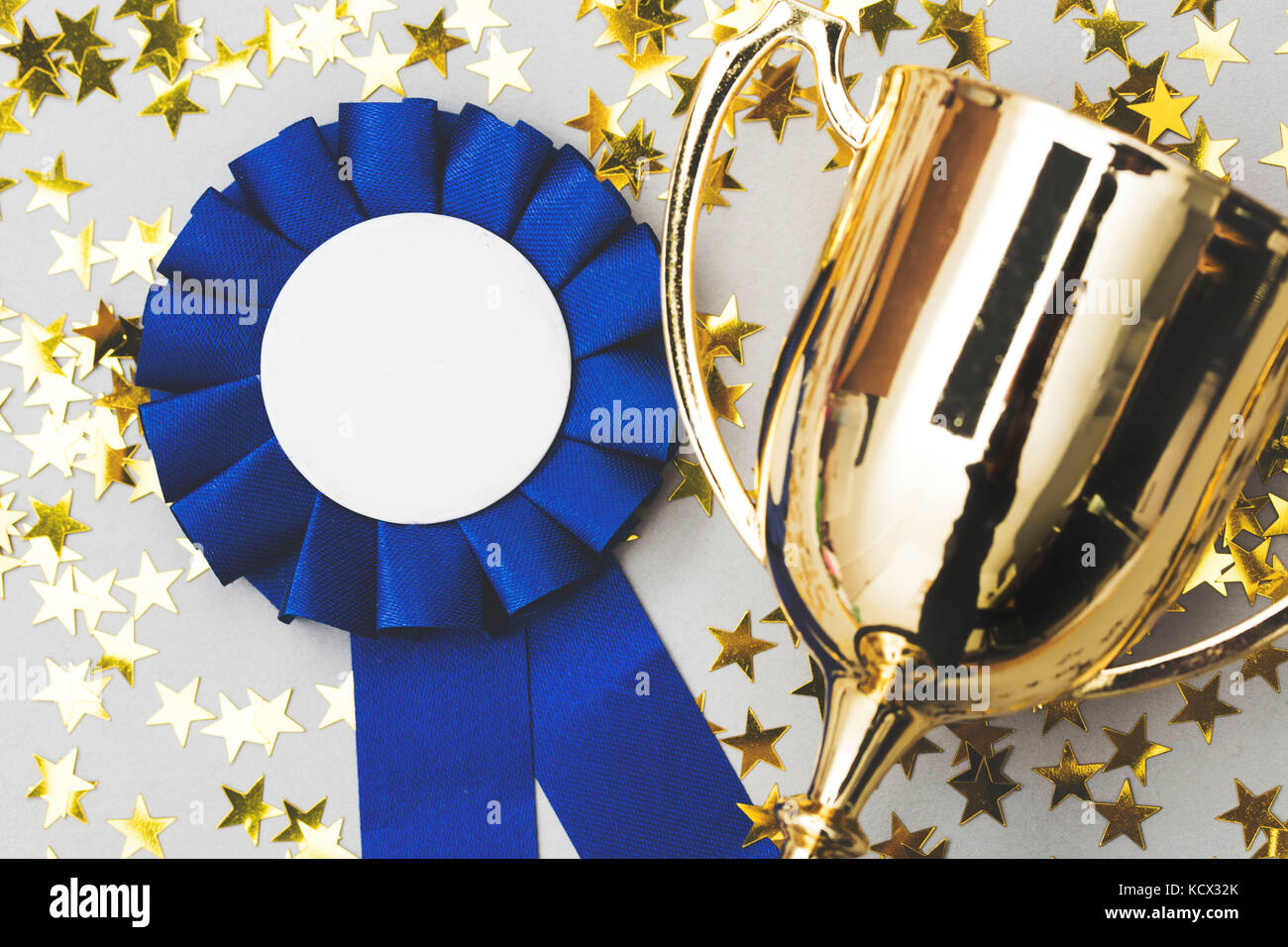 Winners background with trophy and rosette Stock Photo - Alamy
