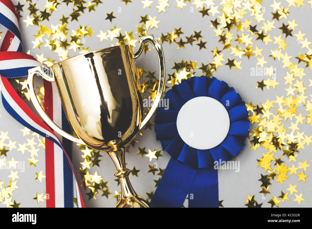 Winners background with trophy and rosette Stock Photo - Alamy