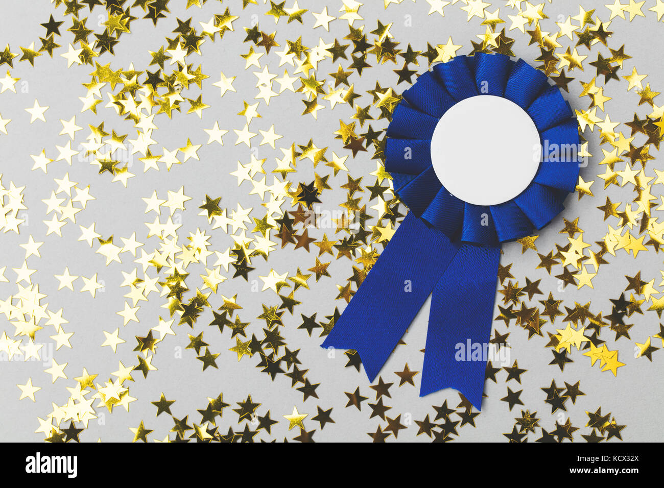 First place award rosette with gold stars. Success achievement concept ...