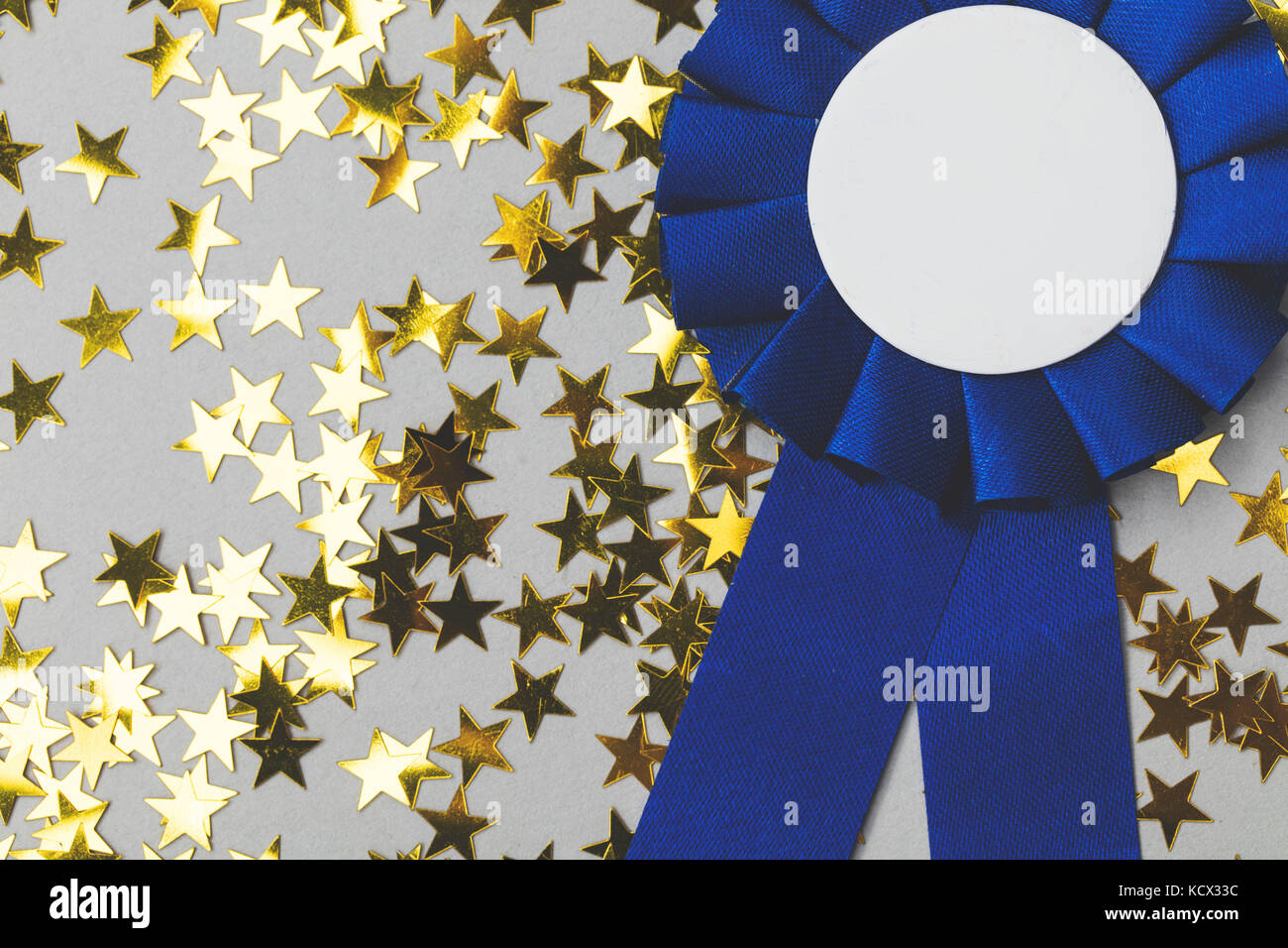 First place award rosette with gold stars. Success achievement concept ...