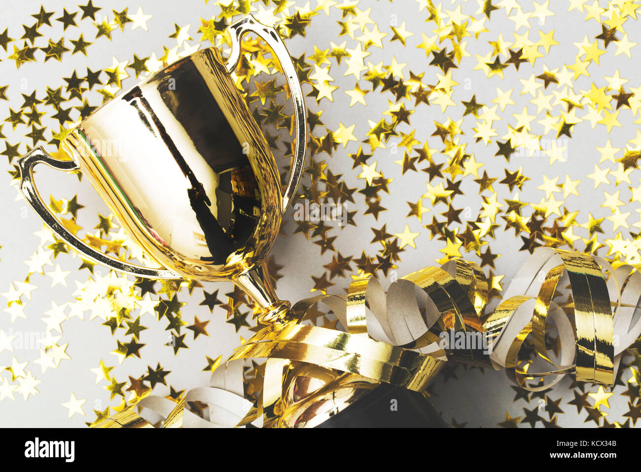Gold winners trophy with golden shiny stars Stock Photo - Alamy