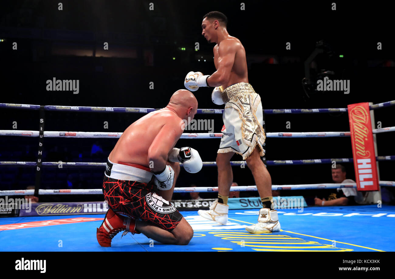 Marcus Morrison (right) knocks down Mariusz Biskupski during their ...