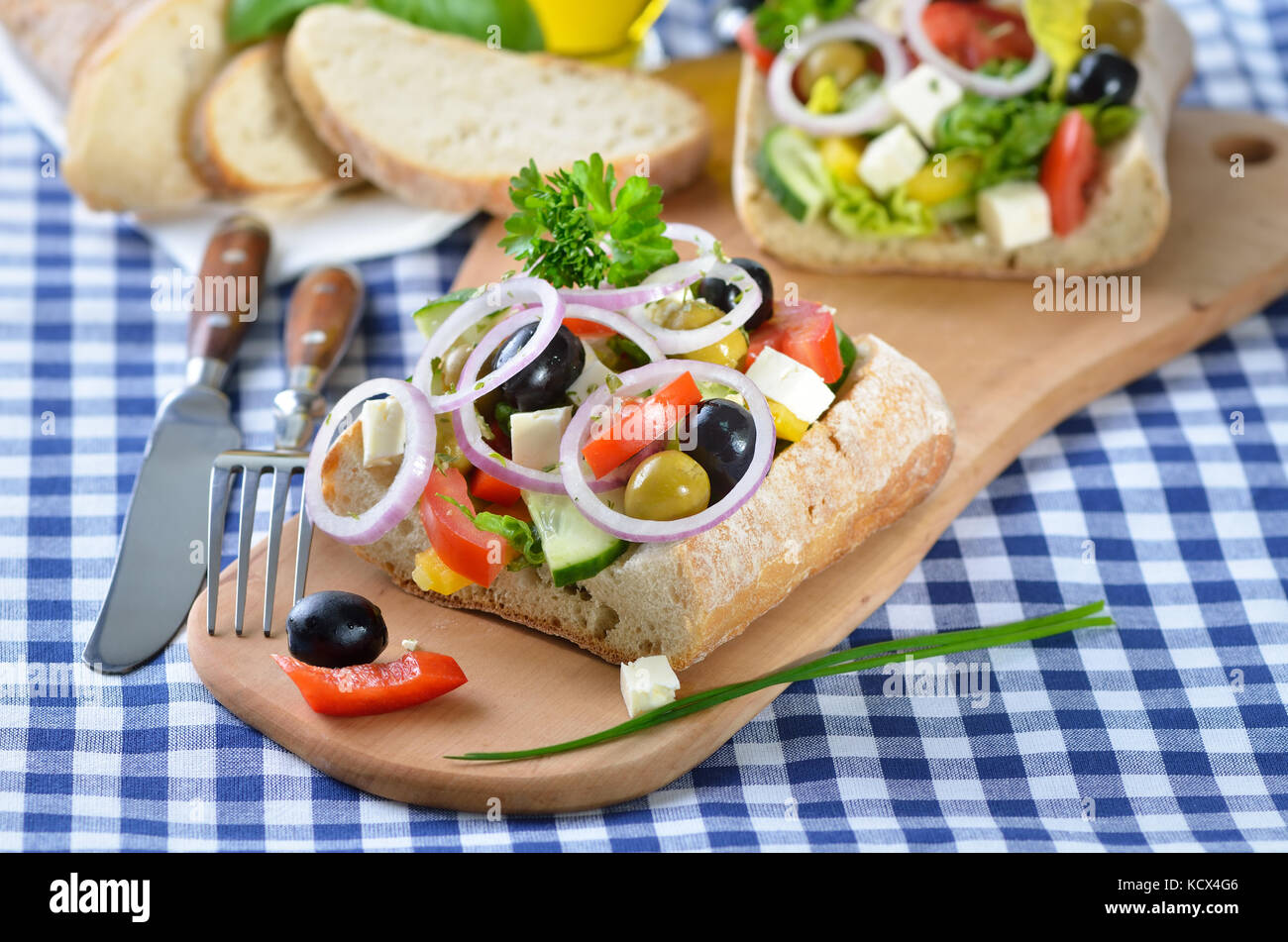 Delicious Greek country salad with feta on bread Stock Photo - Alamy