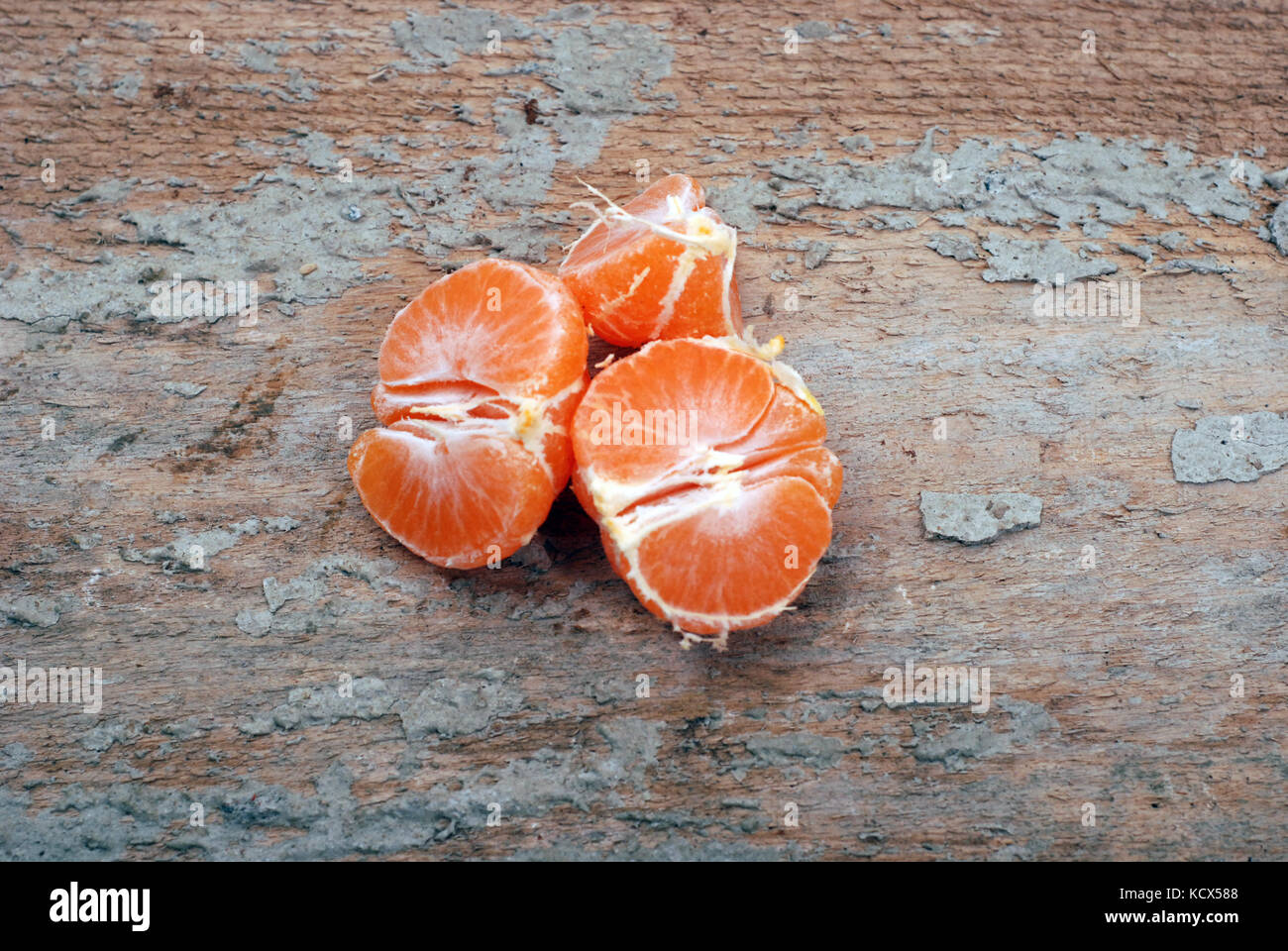 picture of a Peeled Slices of Orange on wood cement backgrounds, group ...