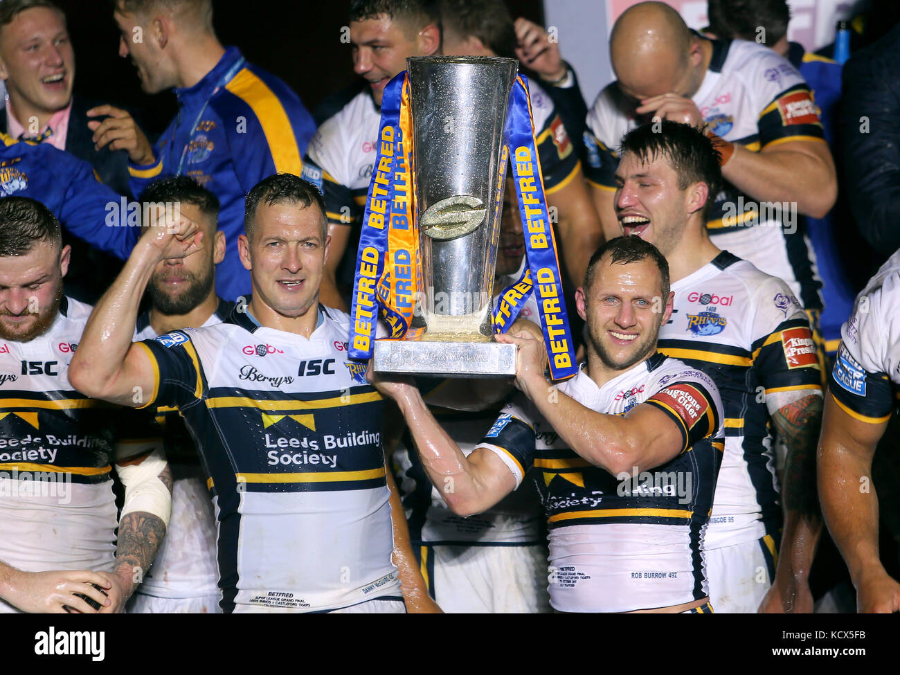 Leeds Rhinos players celebrate with the Super League Grand Final trophy ...