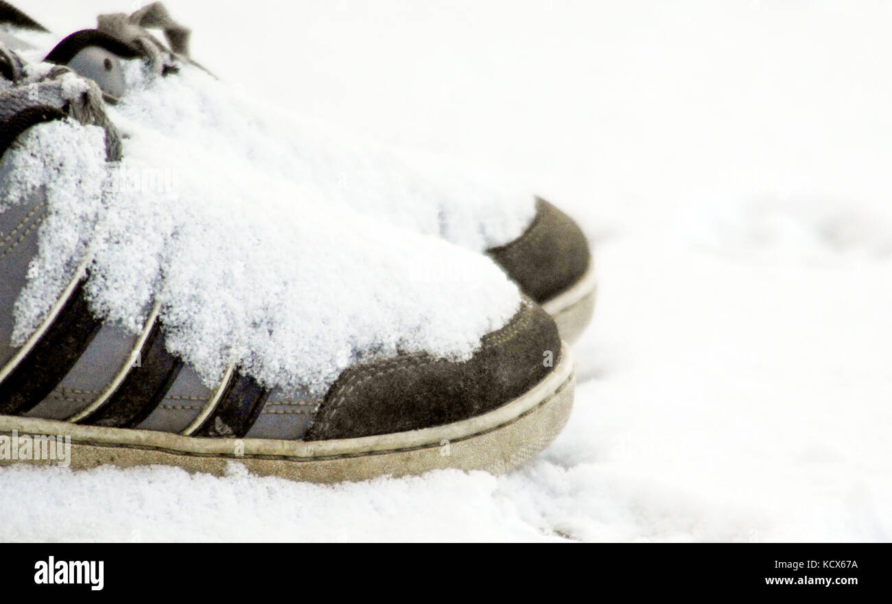 picture of a man shoes covered with snow Stock Photo - Alamy