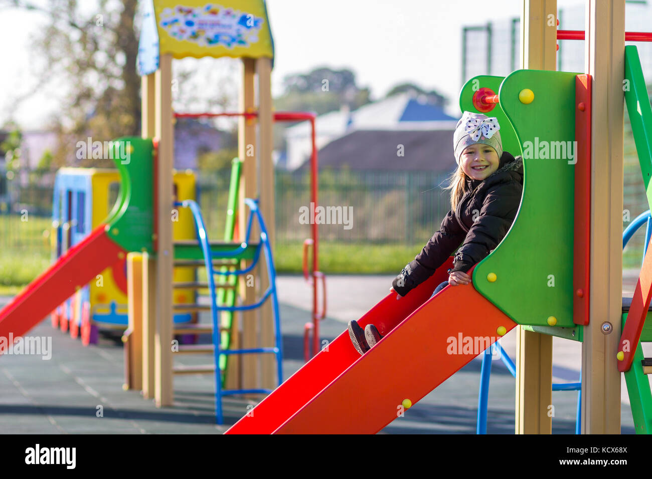Child little pretty girl playing on playground outdoors Stock Photo - Alamy