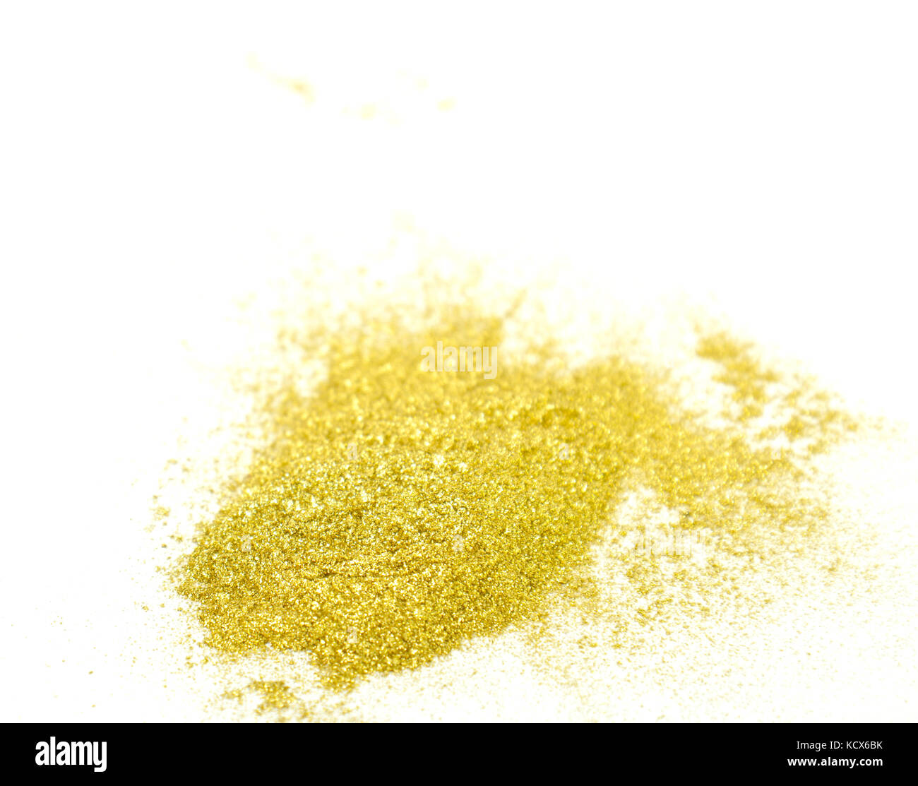 image of a gold glitter powder on white background Stock Photo - Alamy