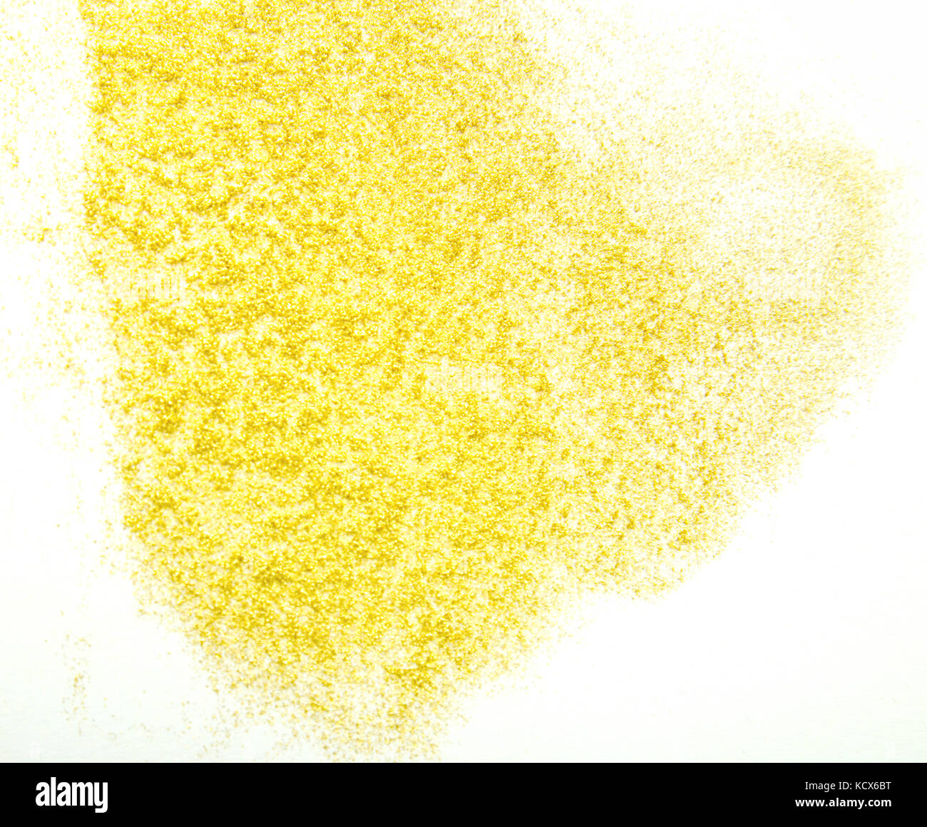 image of a gold glitter powder on white background Stock Photo - Alamy