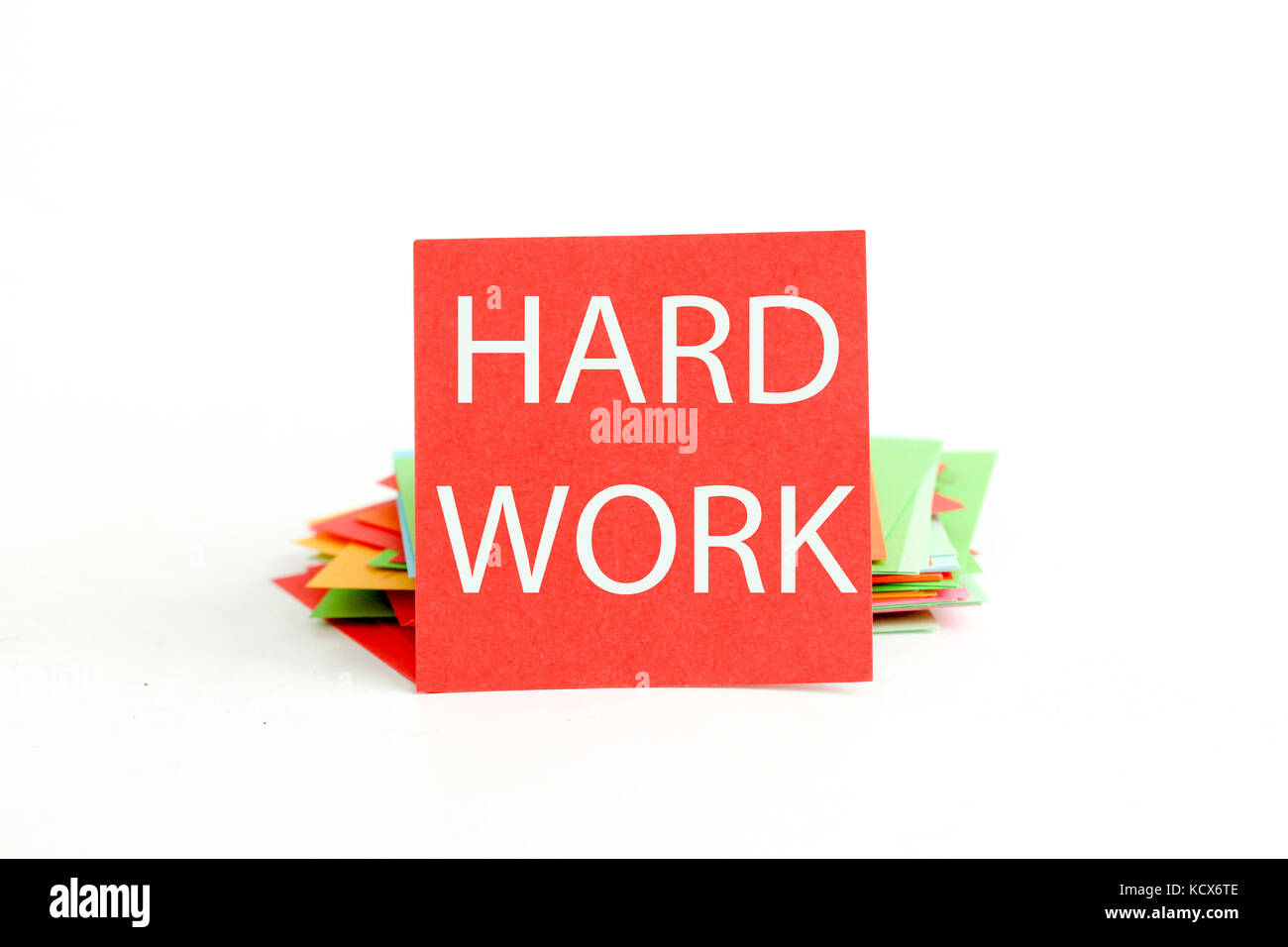 picture of a red note paper with text hard work Stock Photo - Alamy