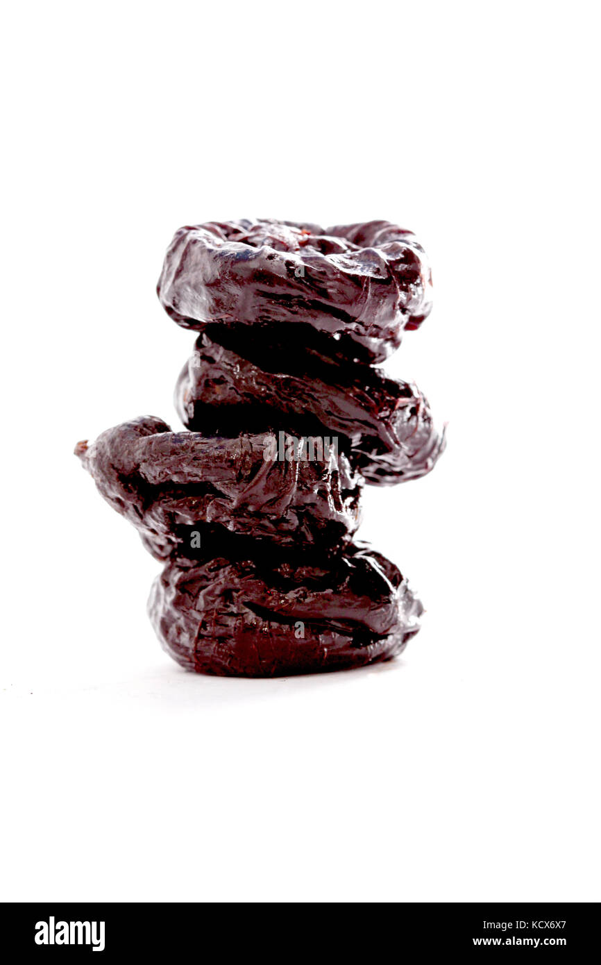 Dried seedless plums isolated on the white background Stock Photo - Alamy