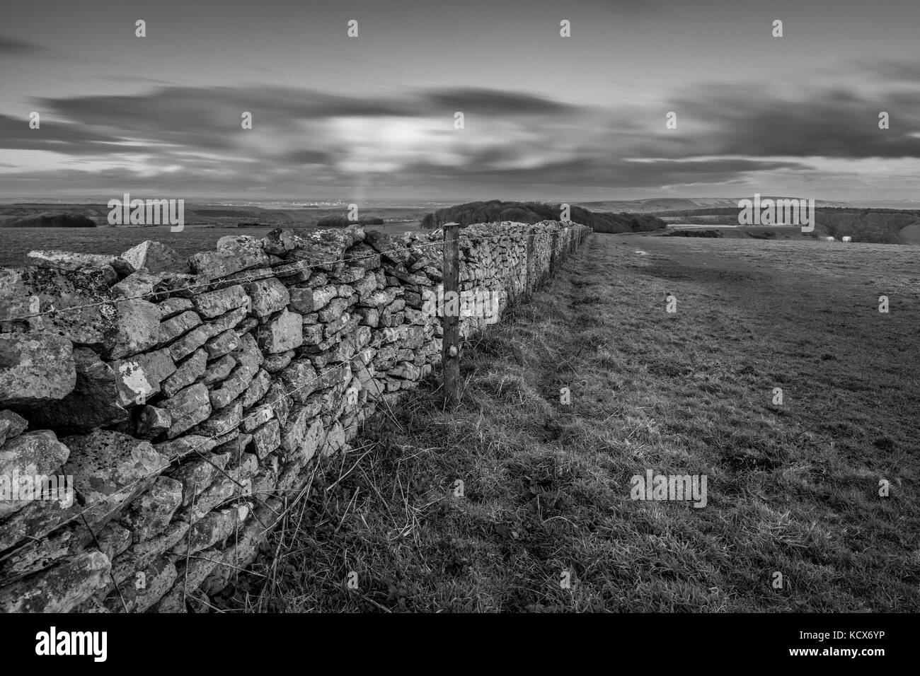 long dry stone wall on farmers field on ridge Stock Photo - Alamy