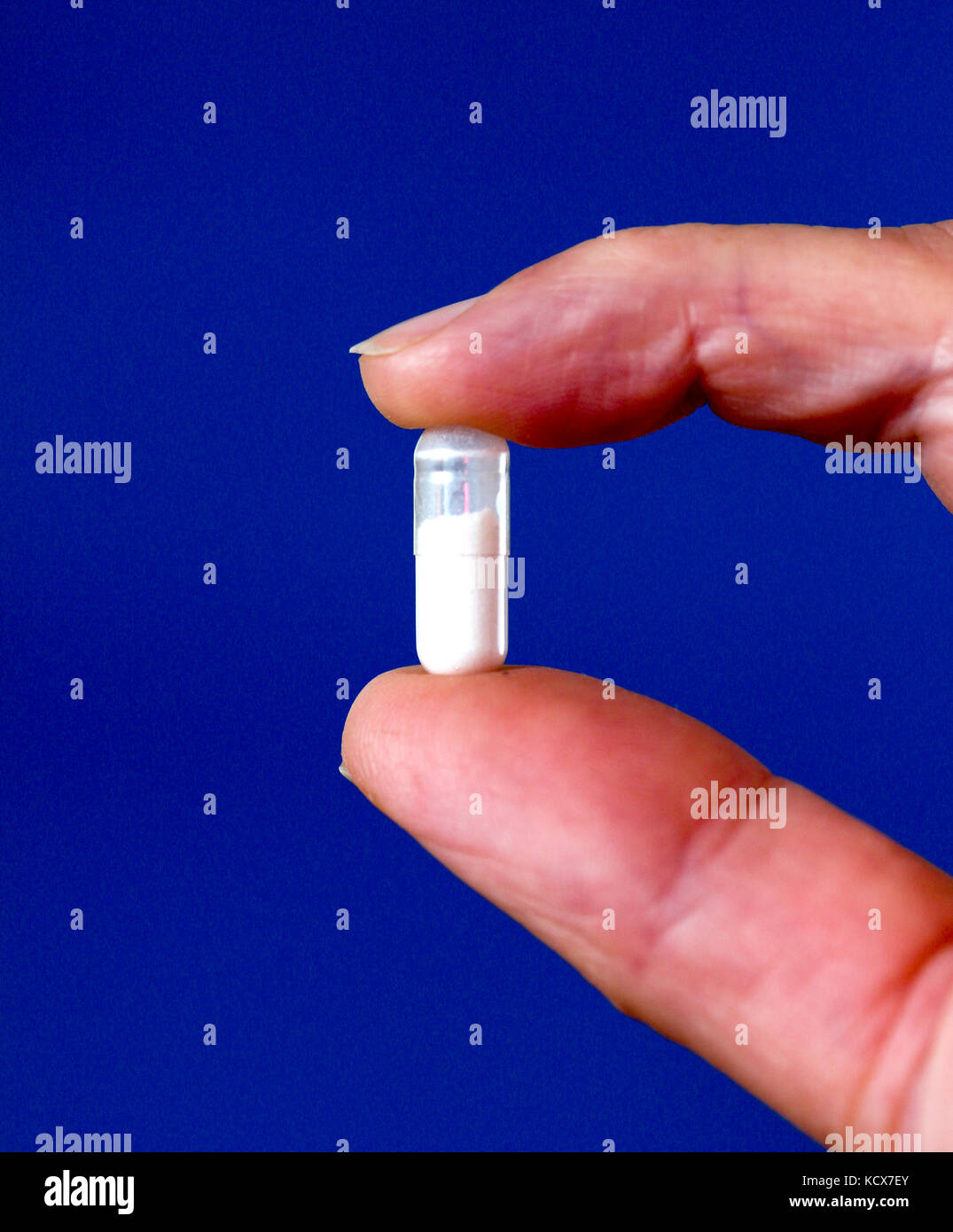 picture of a Pill, Tablet, Capsule on a fingers,health concept Stock ...
