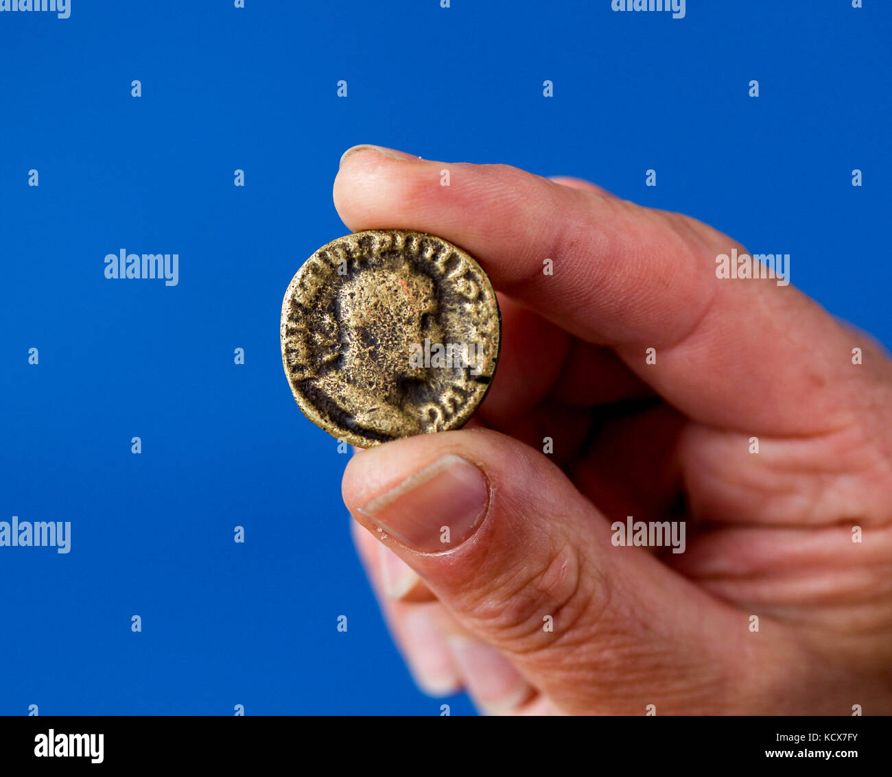 picture of a Fingers hold ancient coin Stock Photo - Alamy