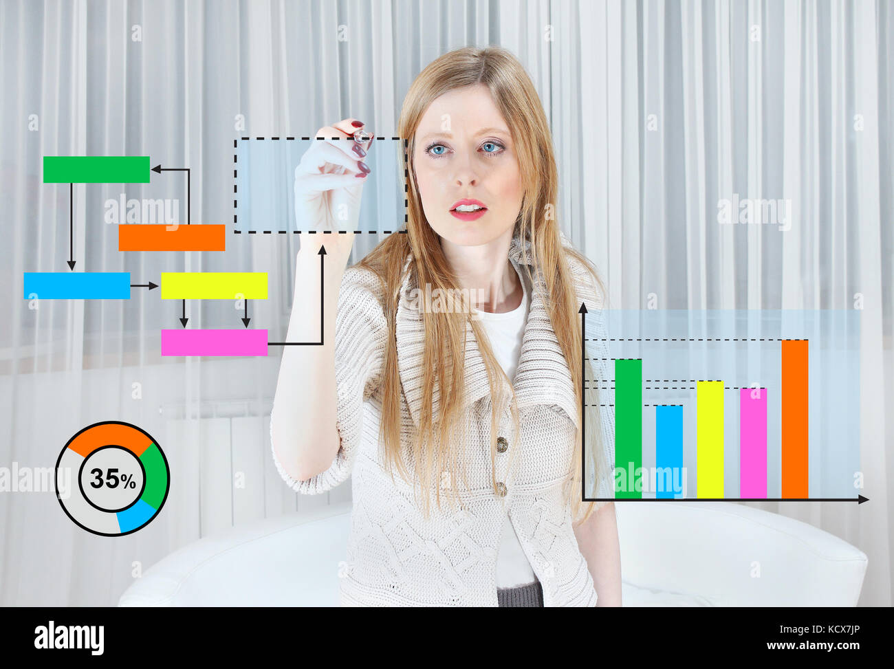 Young woman drawing colorful charts by hand Stock Photo - Alamy