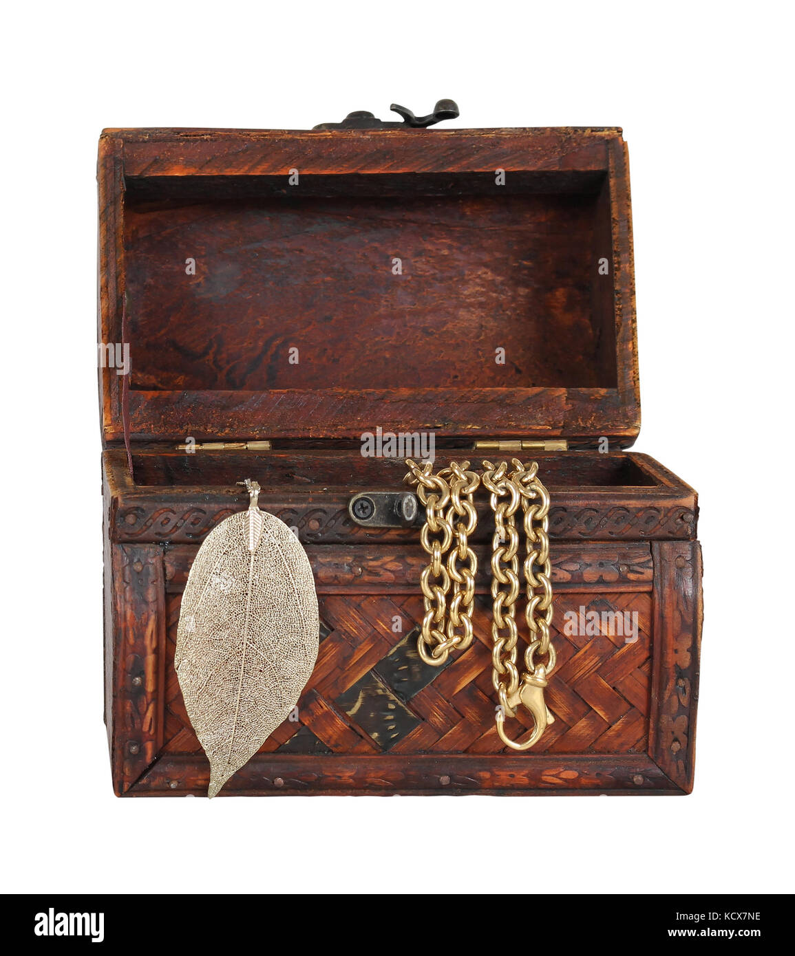 Old vintage chest with open lid and gold jewelry hanging out isolated ...