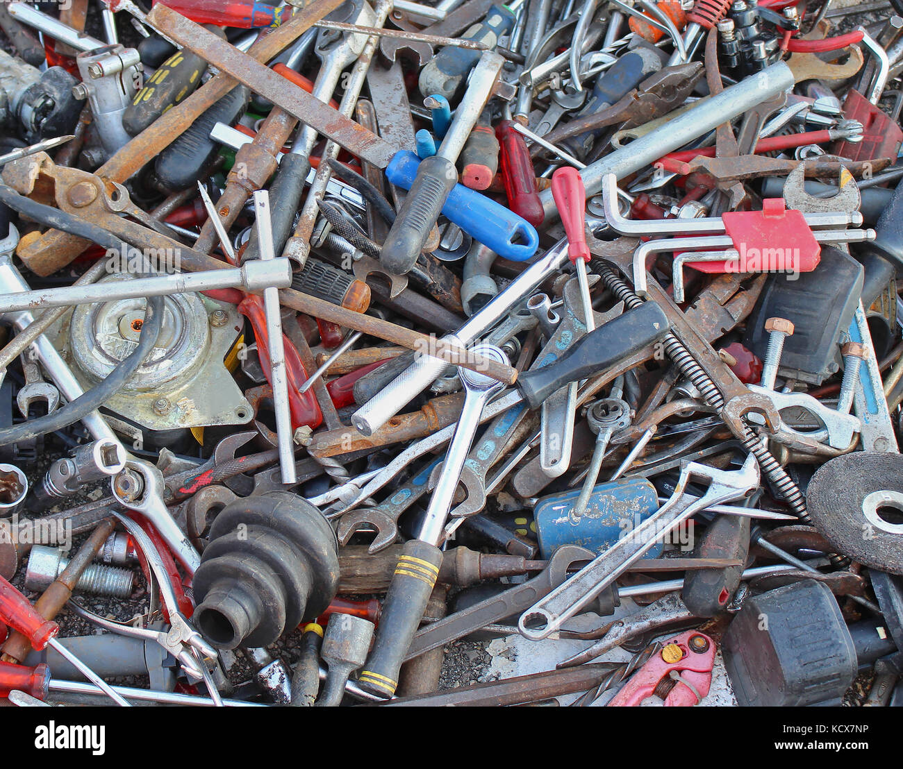 Big pile of used rusty old tools Stock Photo - Alamy