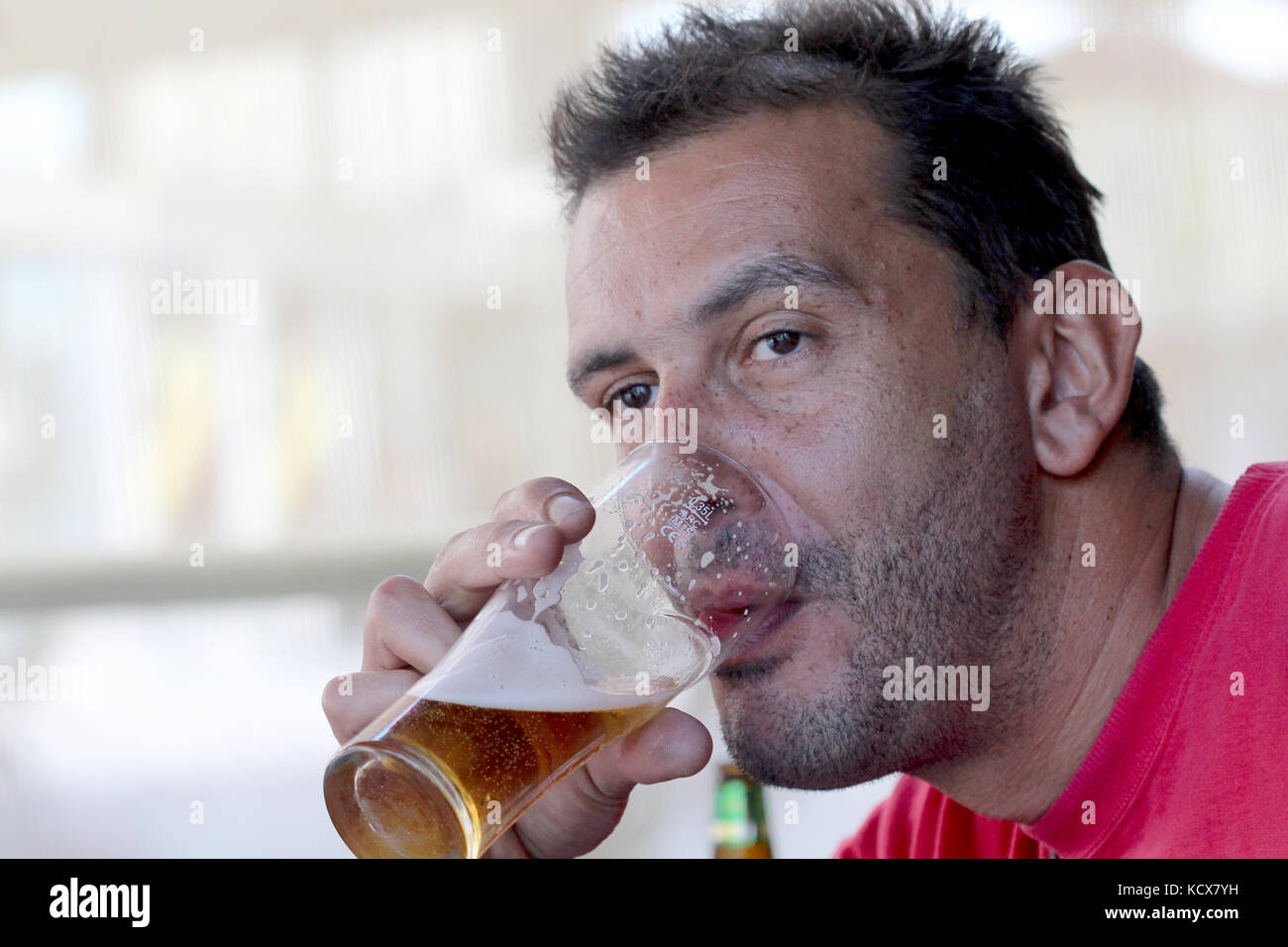 Men drinking beer. Portrait of handsome men drinking beer Stock Photo ...
