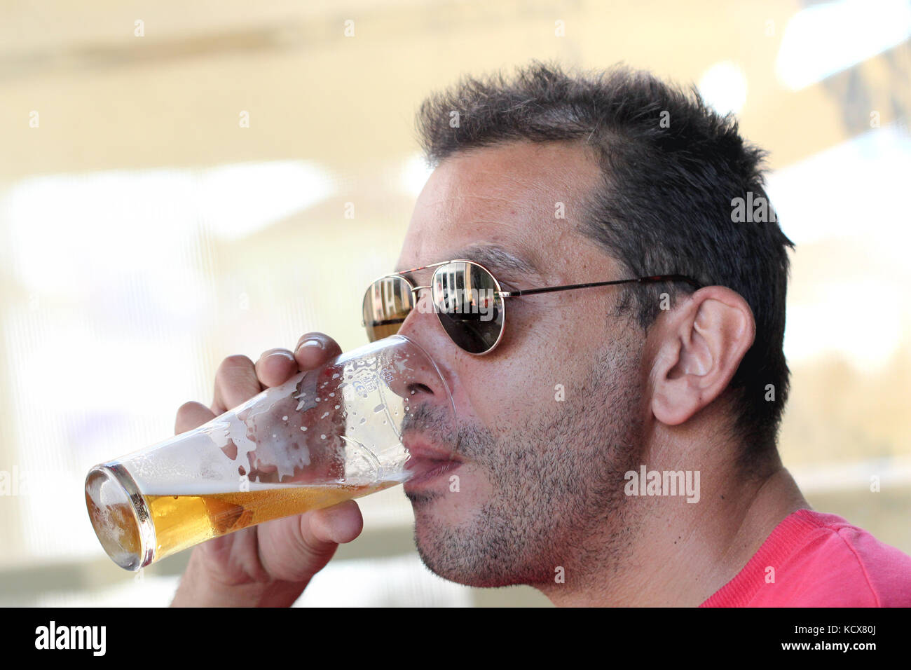 Men drinking beer. Portrait of handsome men drinking beer Stock Photo ...