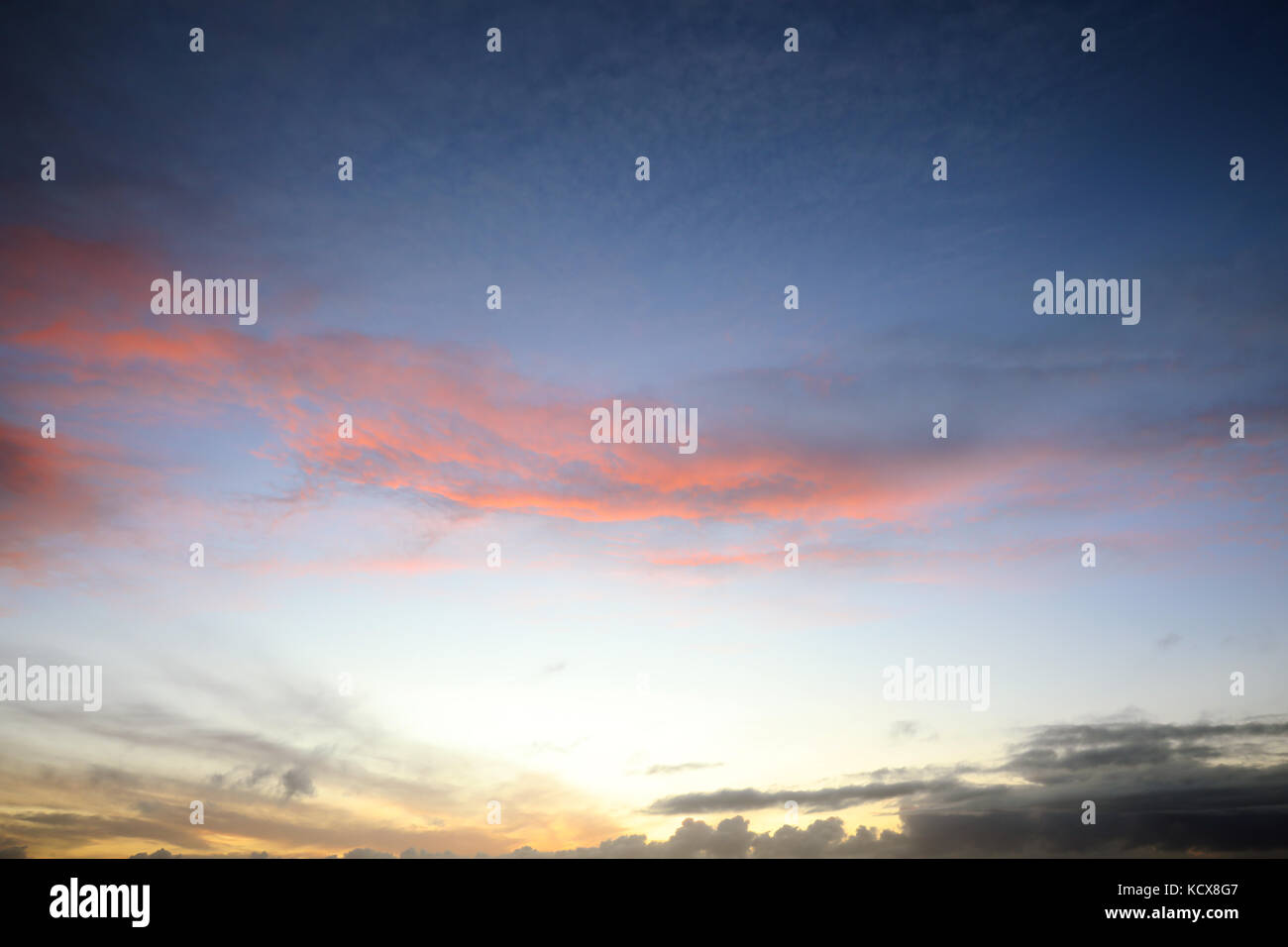 Vanilla clouds, sunset over the ocean in Iceland Stock Photo - Alamy