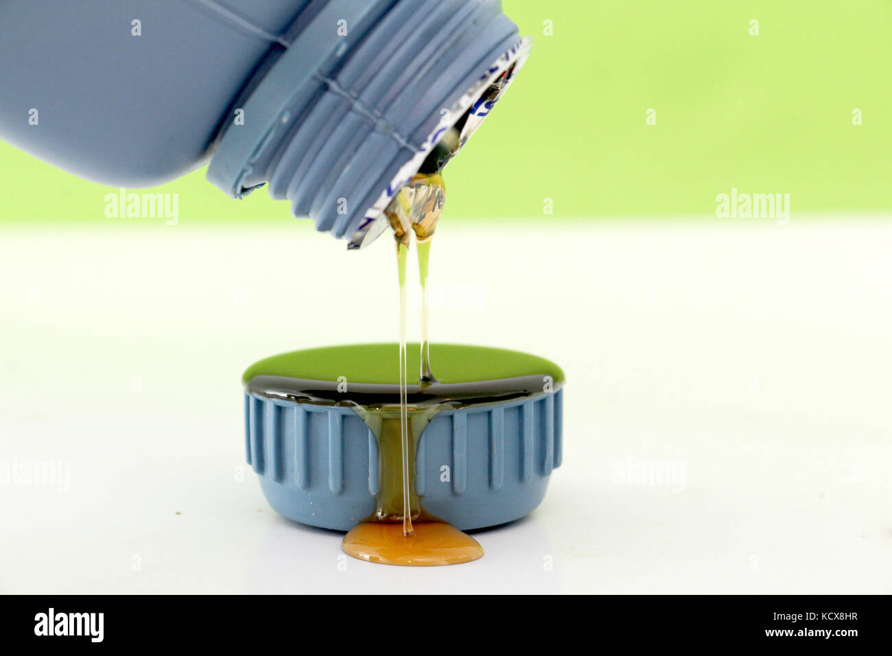 picture of a motor oil , bottle,cap, shot in a studio Stock Photo - Alamy