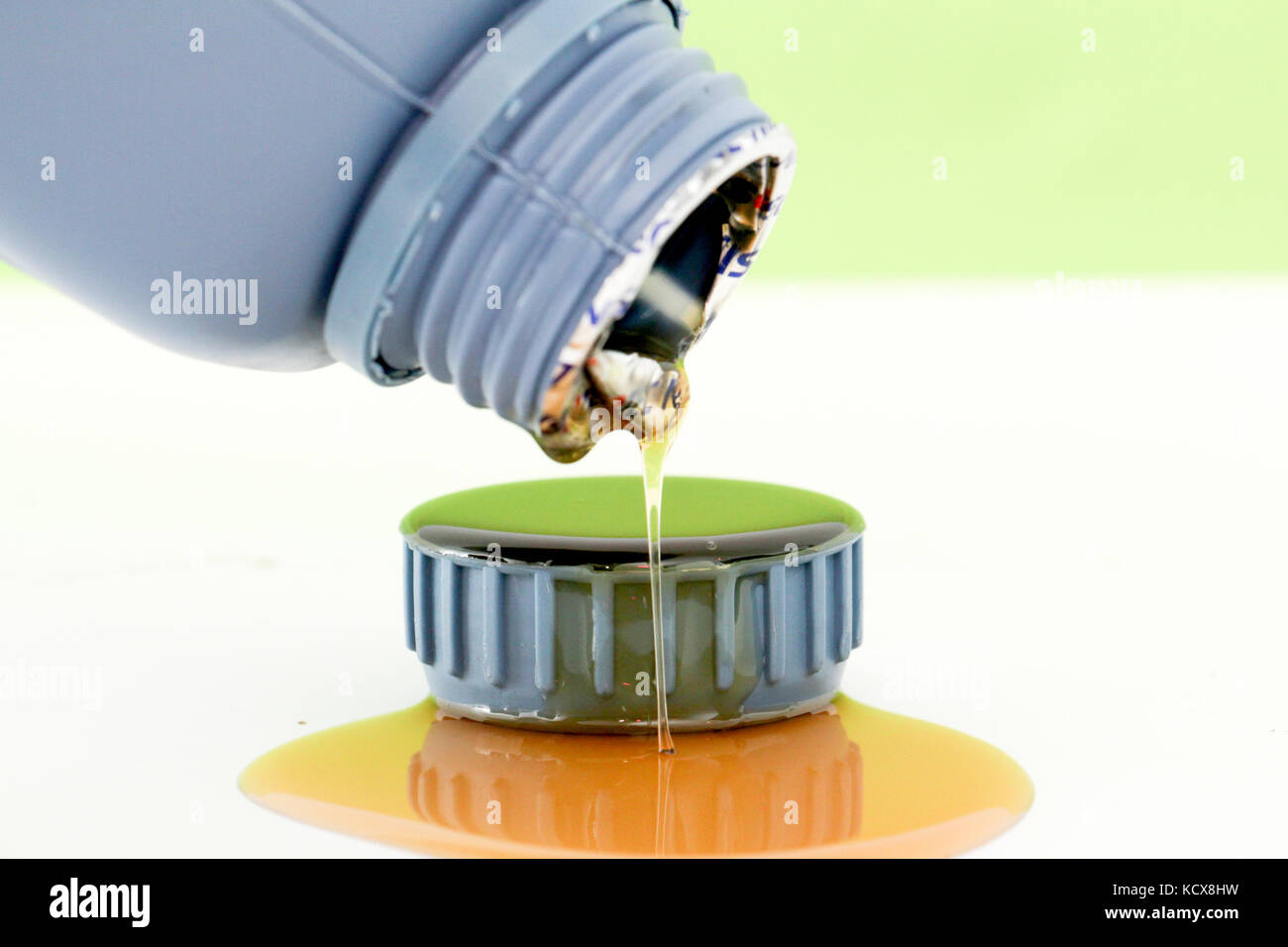 picture of a motor oil , bottle,cap, shot in a studio Stock Photo - Alamy