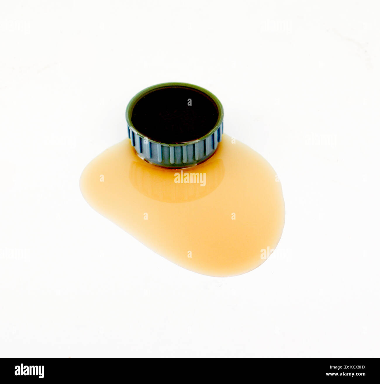 picture of a motor oil , bottle,cap, shot in a studio Stock Photo - Alamy