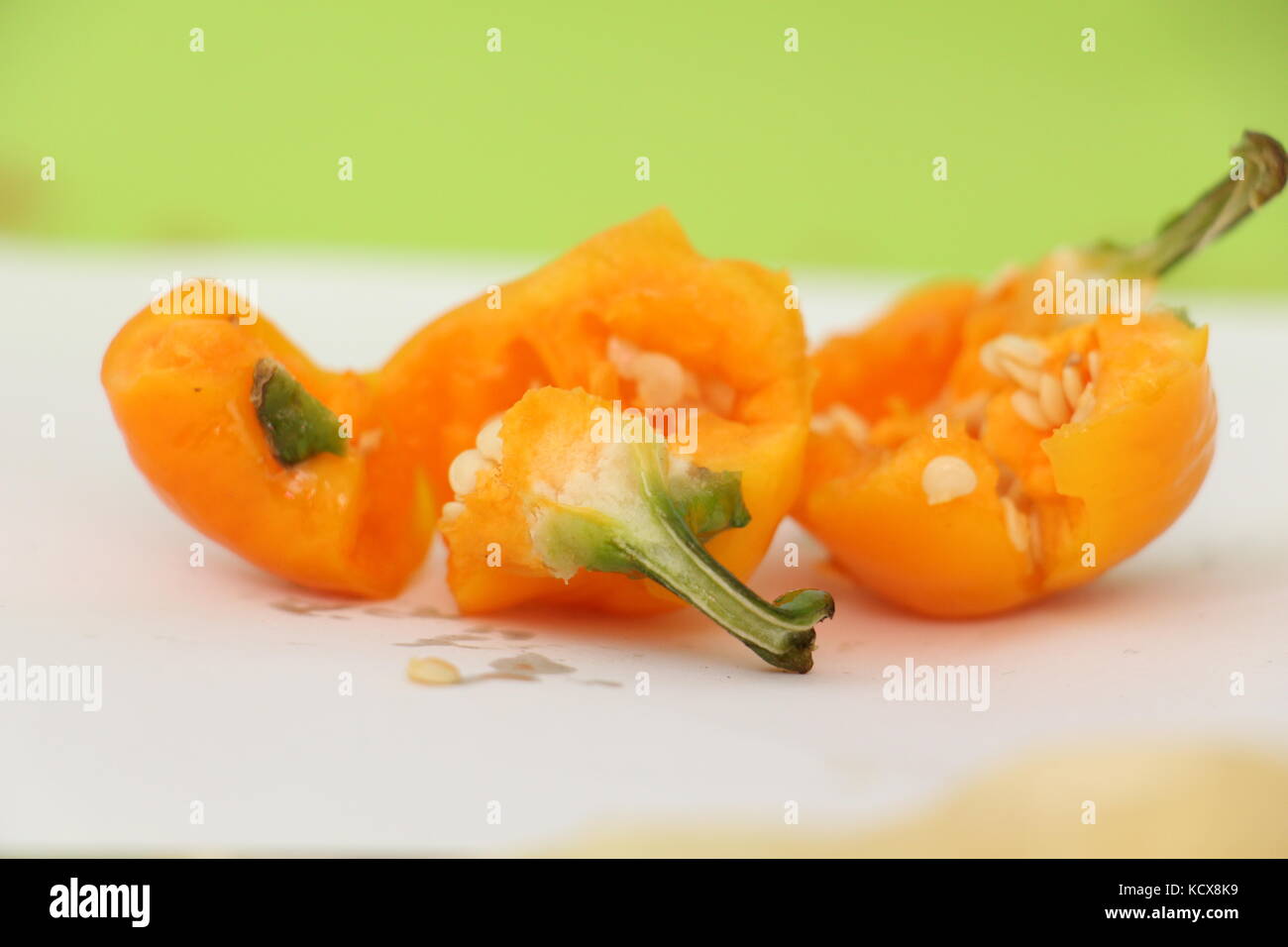 picture of a oily orange chili bell peppers,studio shot Stock Photo - Alamy