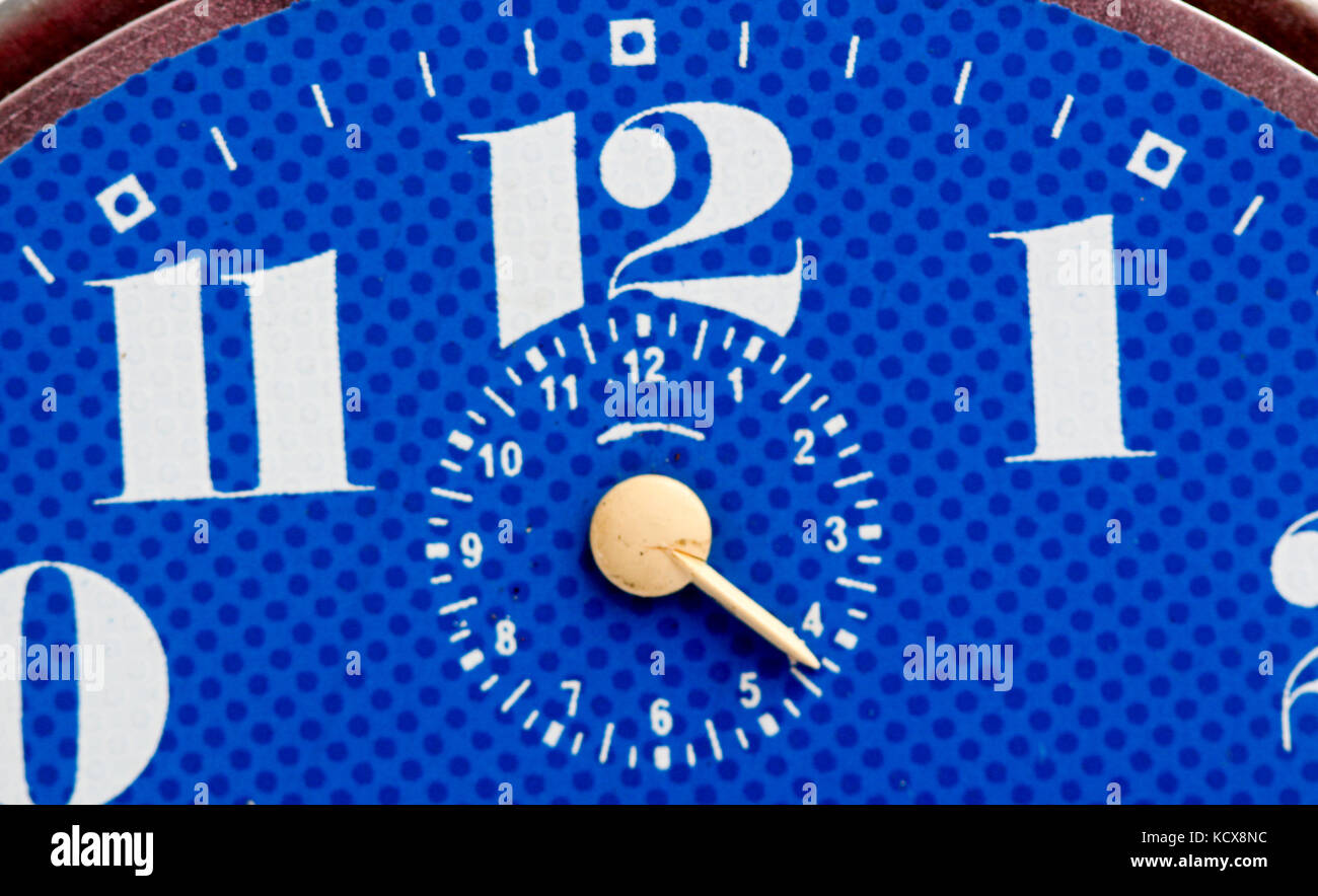 picture of a Closeup of hands on clock face Stock Photo - Alamy