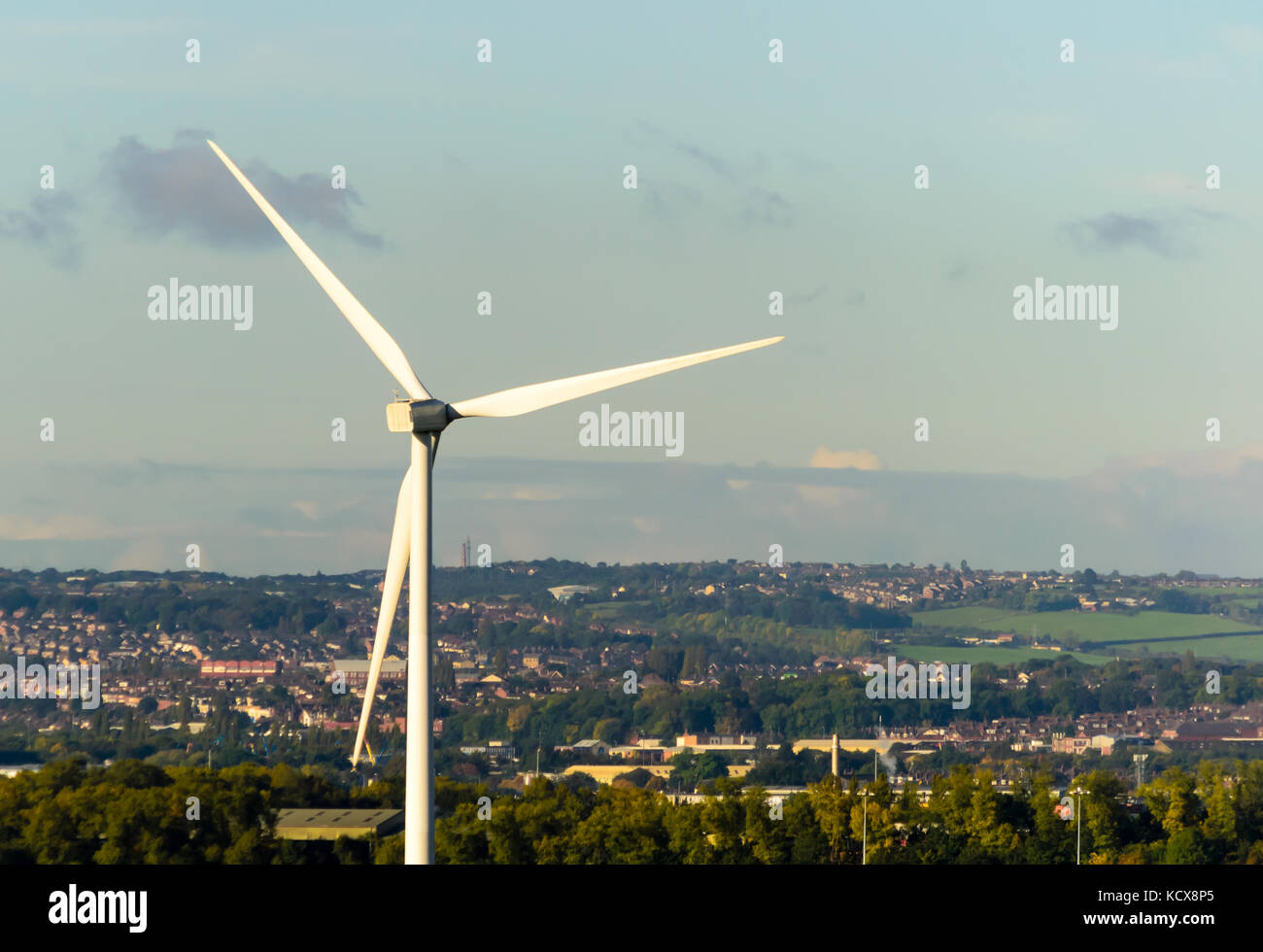 A Windmill to provide energy for the future in from of a town in leeds ...